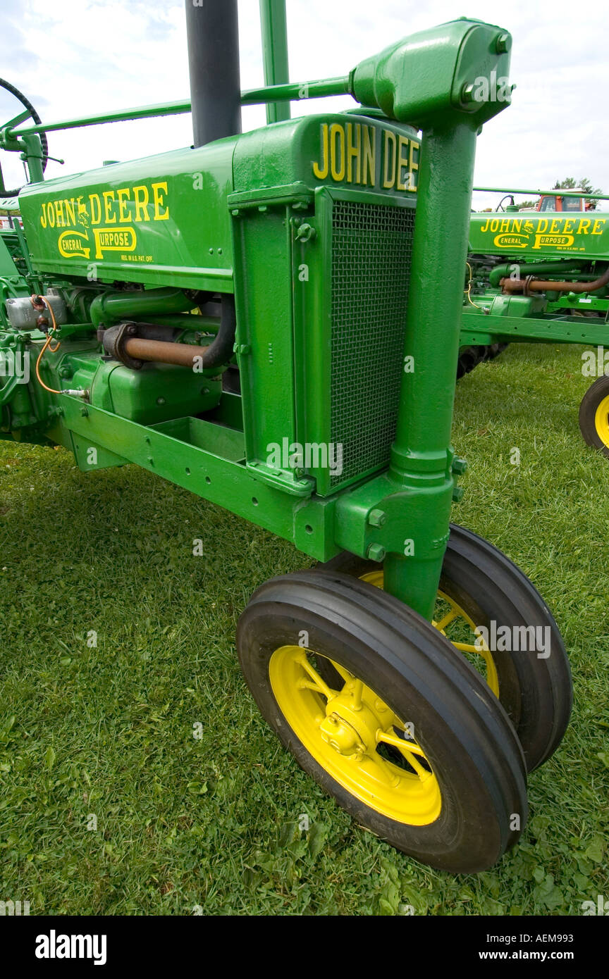 Local farmers display old farm tractors in a circa 1920 saw mill ...