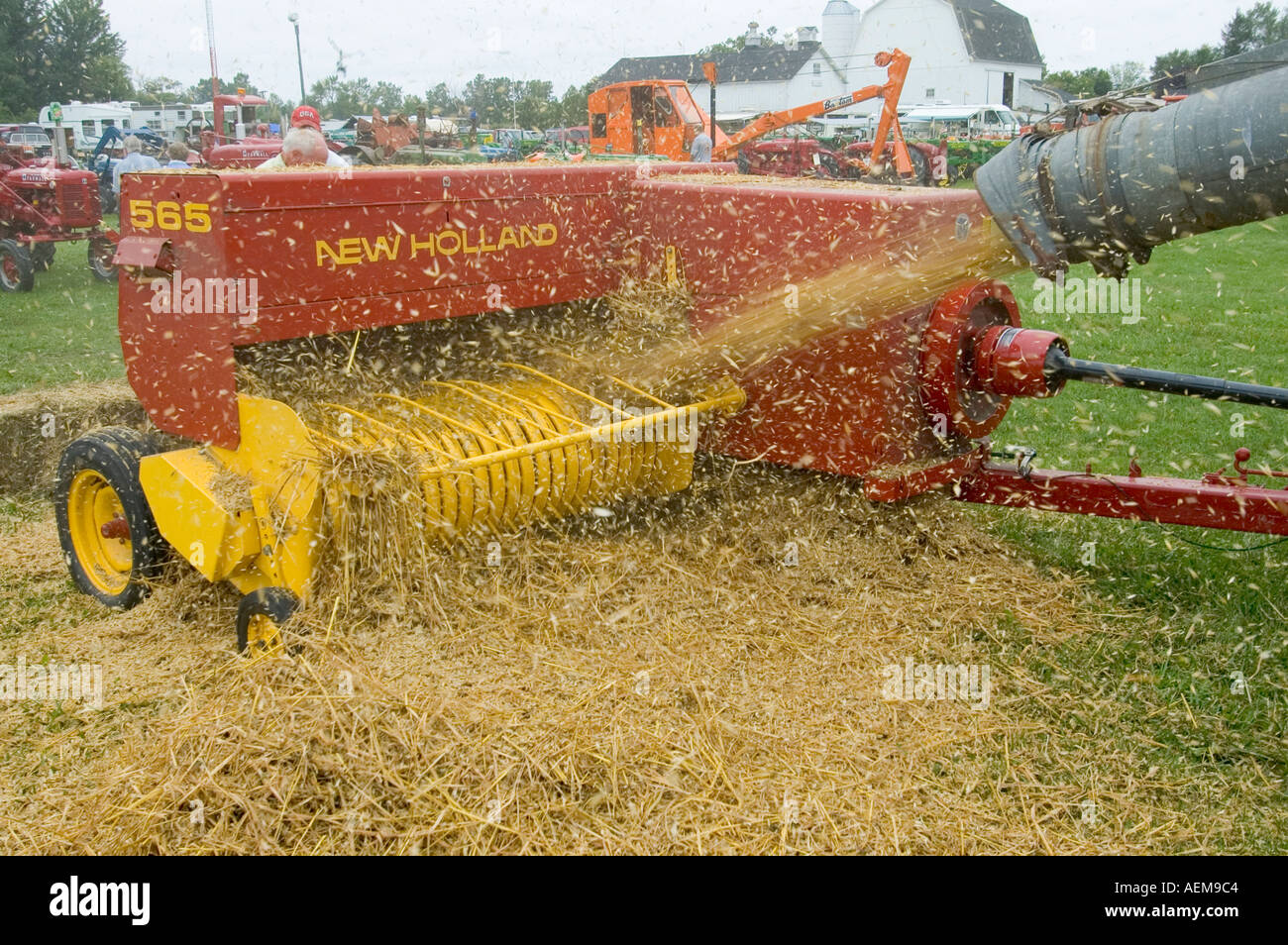 Local farmers demonstrate thrashing oats using techniques in a circa ...