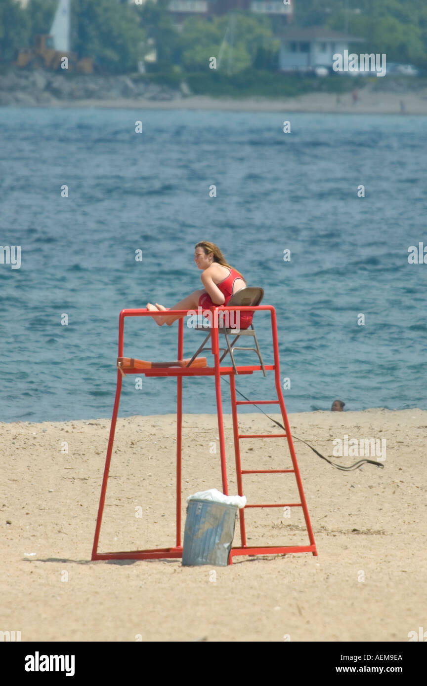 female life guard protect swimmers at a public beach in Port Huron ...