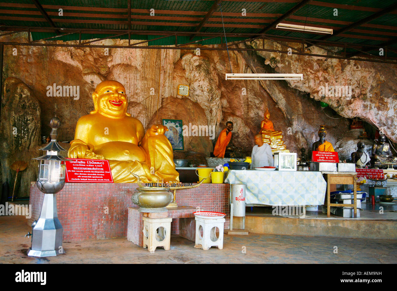 Buddhist shrine in cave at Wat Tham Seua (Tiger Cave Temple), Krabi ...