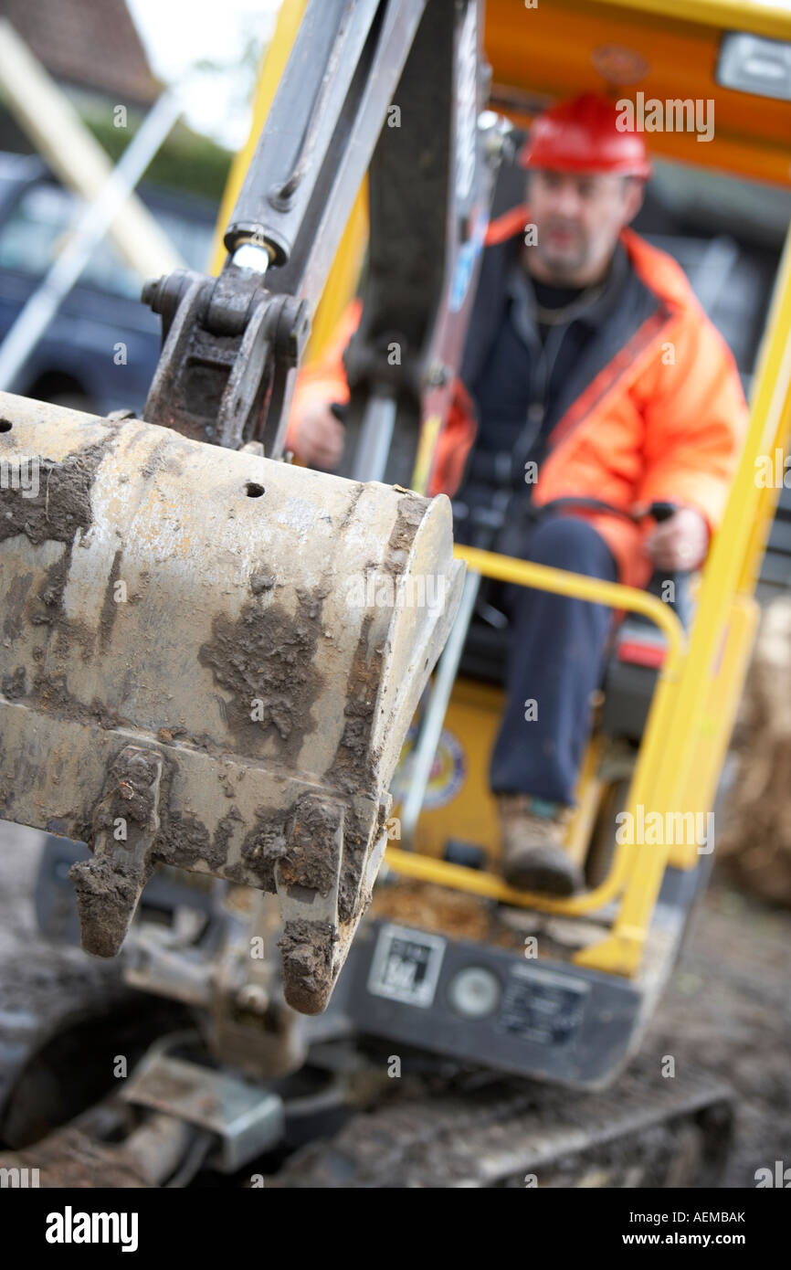 CONSTRUCTION DIGGER DRIVER ON A BRITISH BUILDING SITE Stock Photo - Alamy