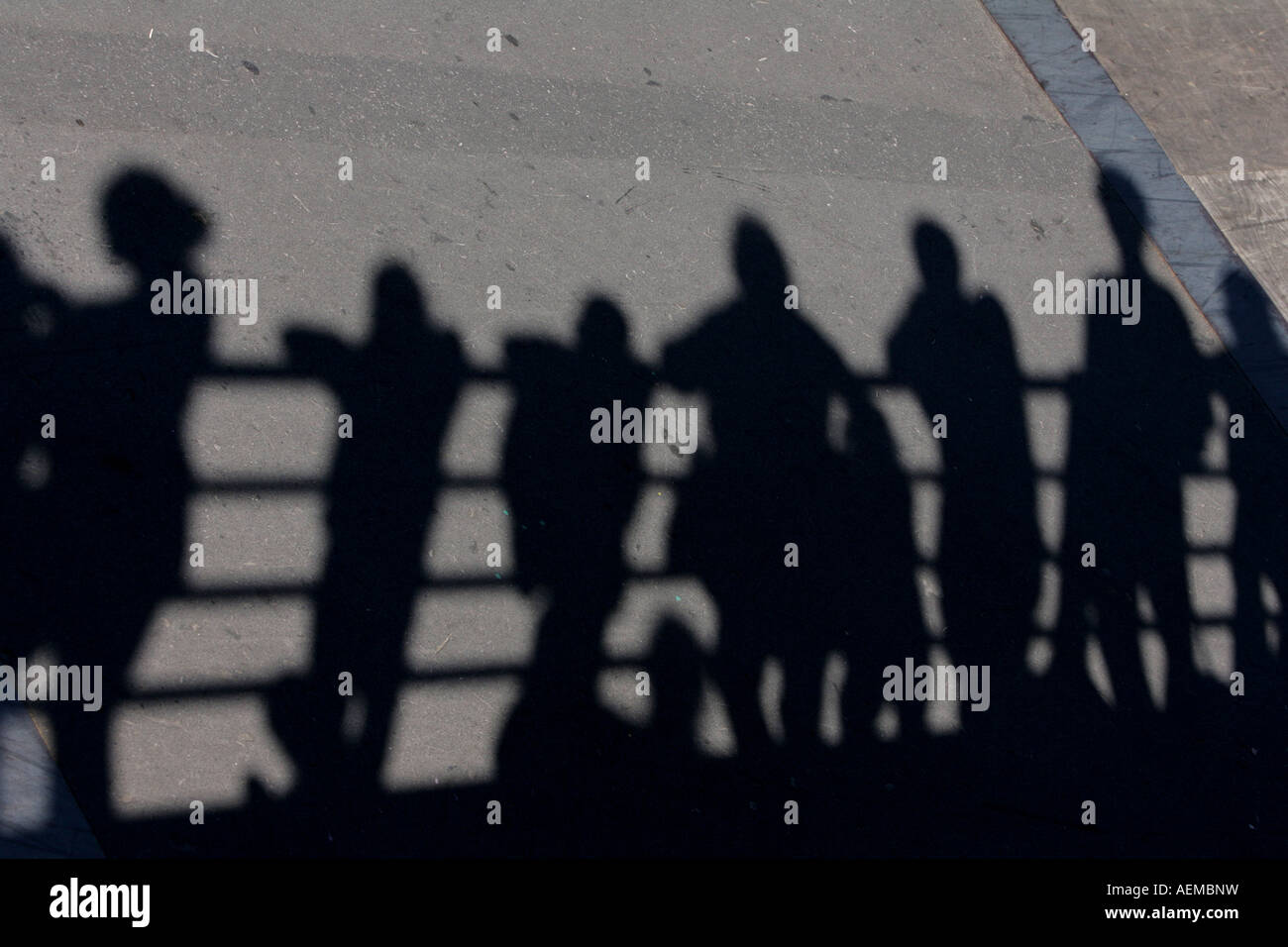 human shadows people on the fence Stock Photo - Alamy