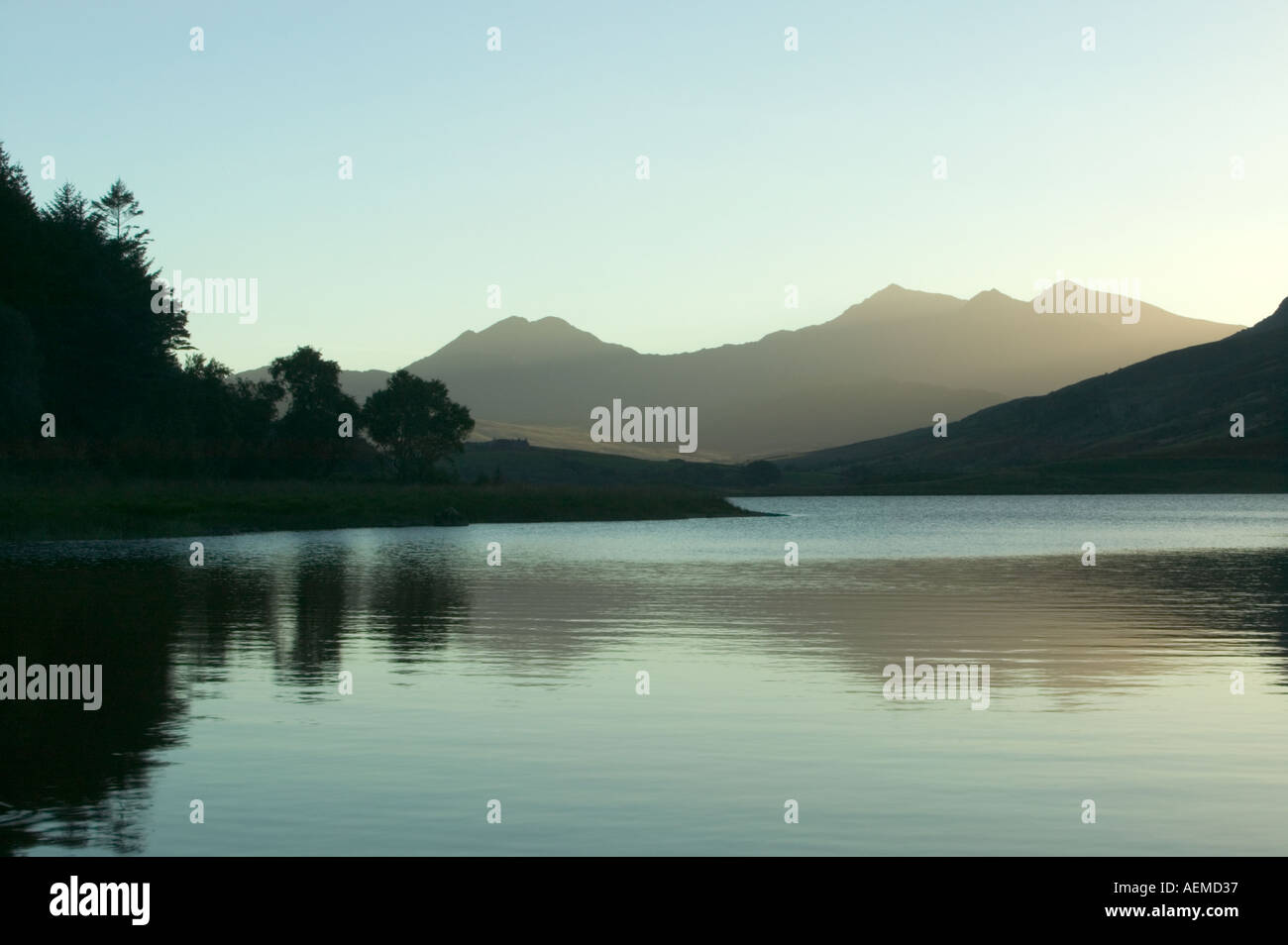Snowdon Mountain at Sunset from across Llyn Mymbwr Snowdonia North West ...
