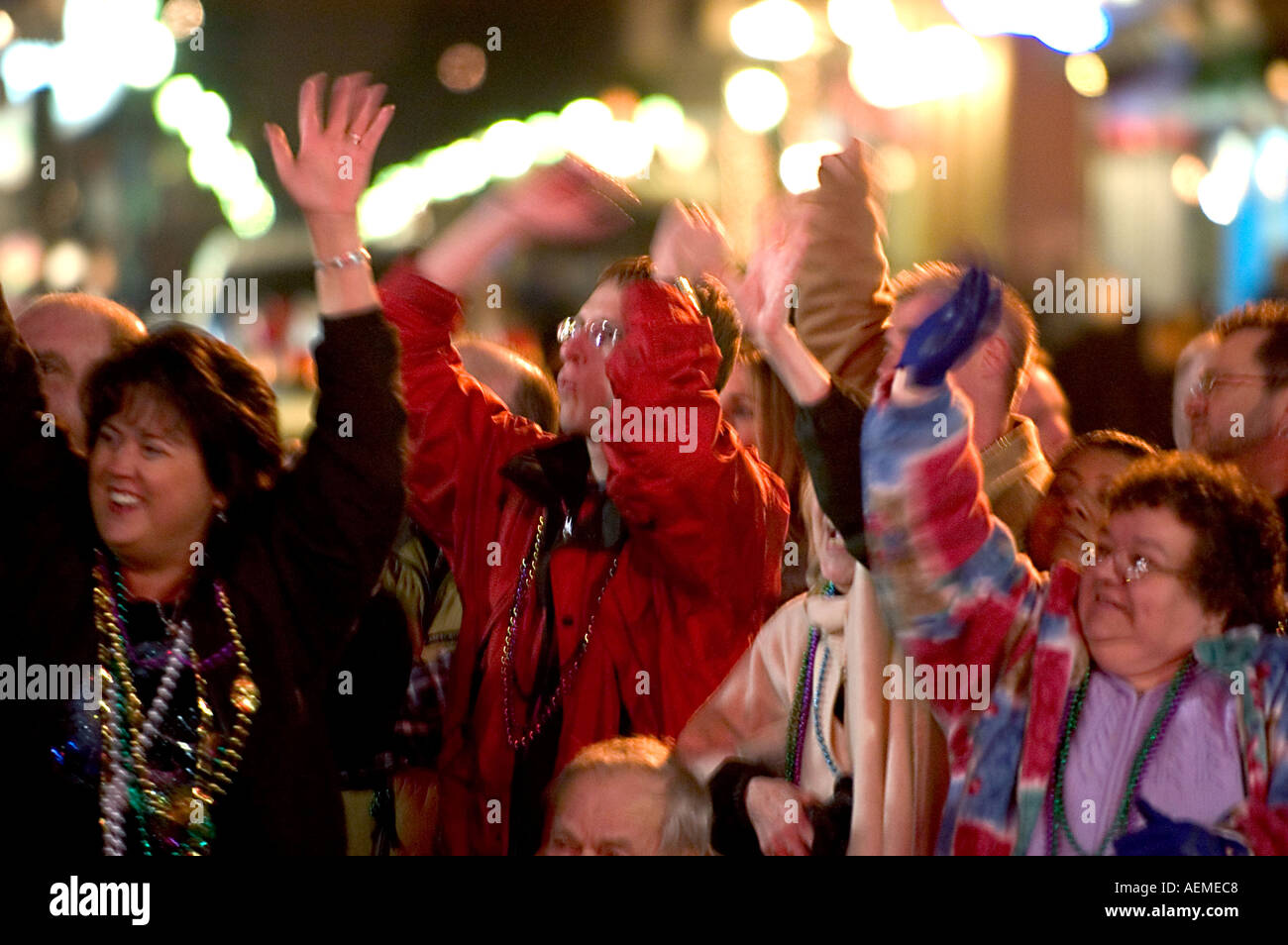 Mardi Gras parade spectators reaching for beads Stock Photo - Alamy