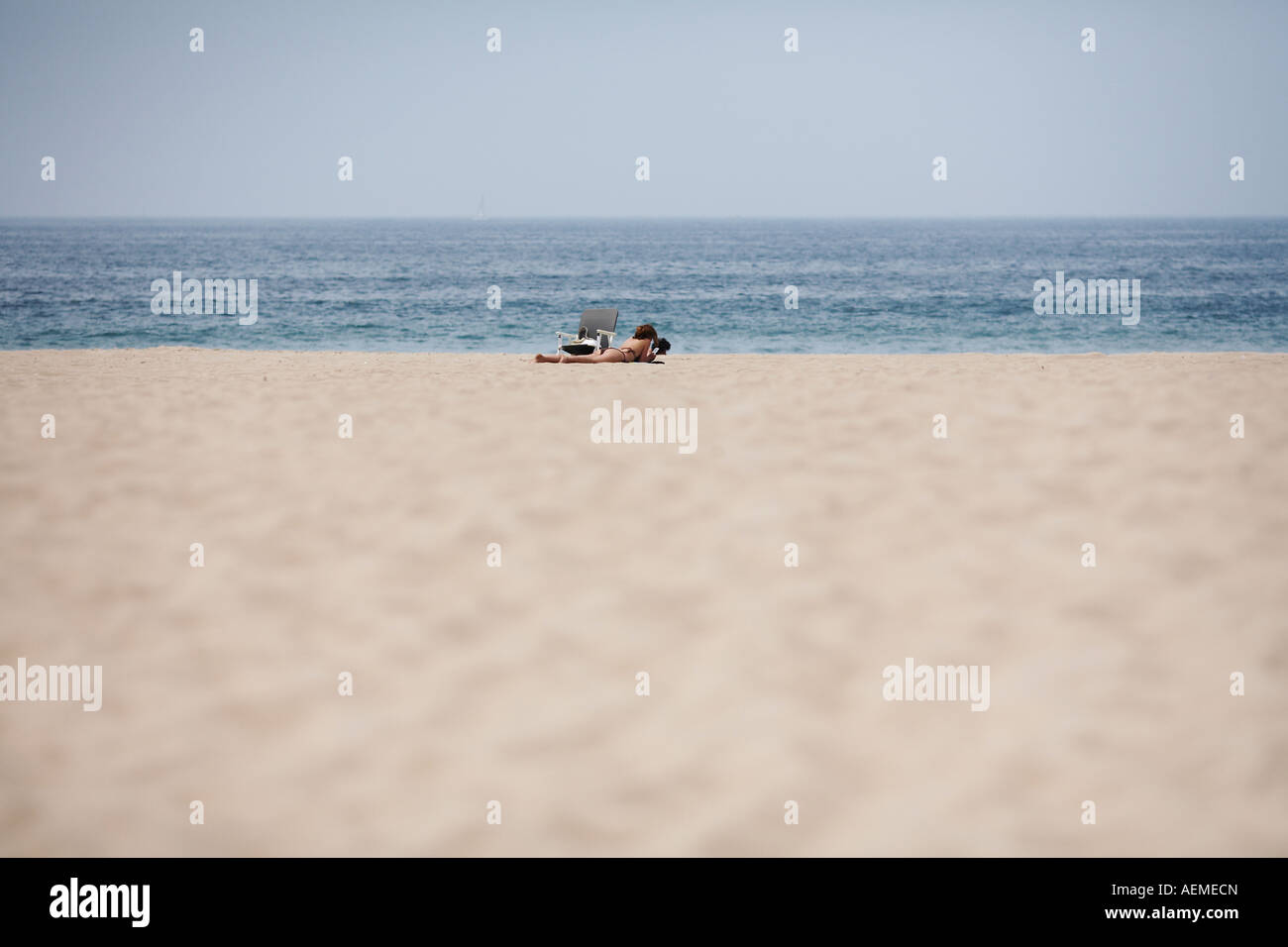Woman Laying in Sand in Manhattan Beach, Los Angeles County, California ...