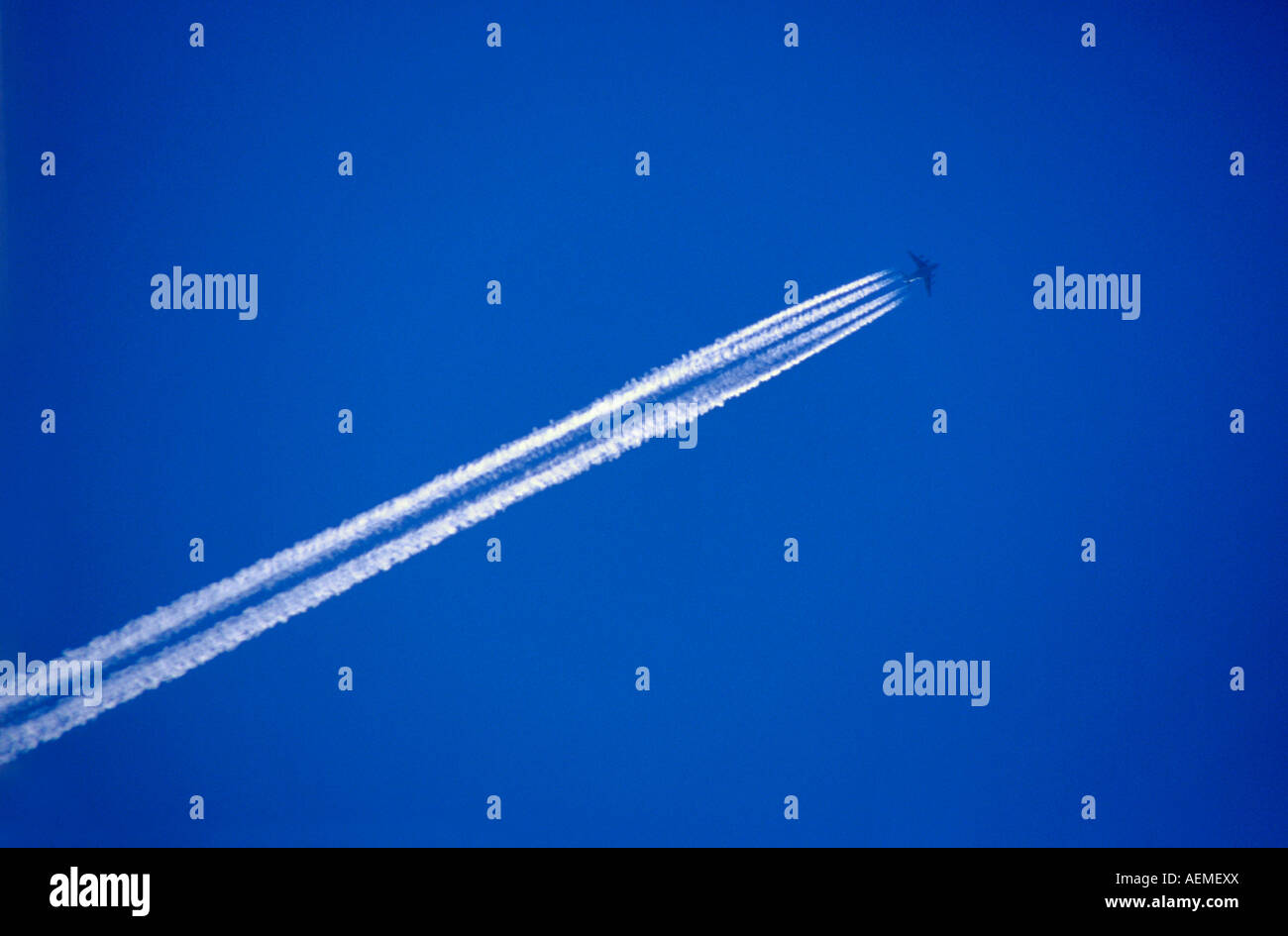 An airplane with vapor trail Stock Photo - Alamy