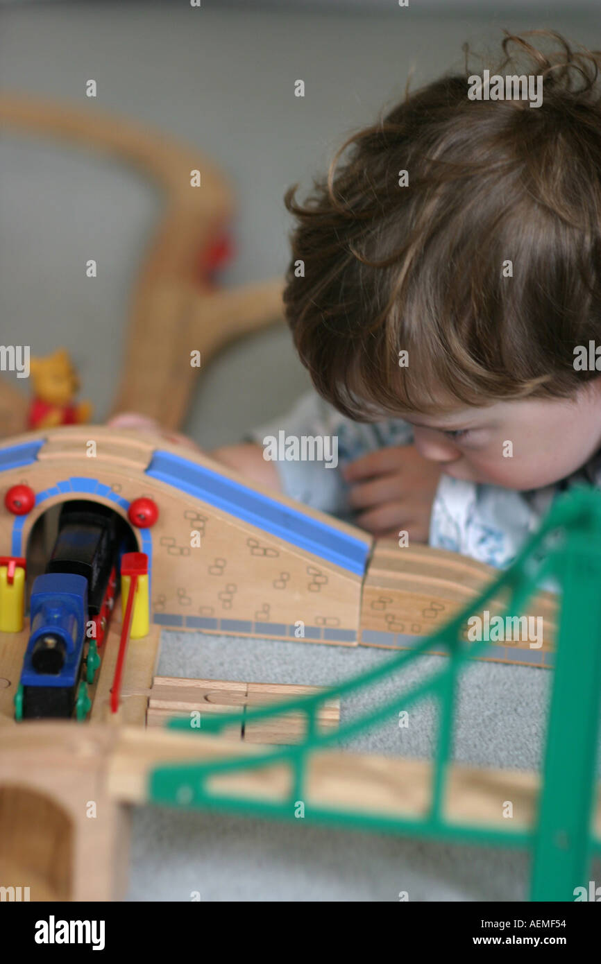 Lewis and his wooden trainset Stock Photo - Alamy