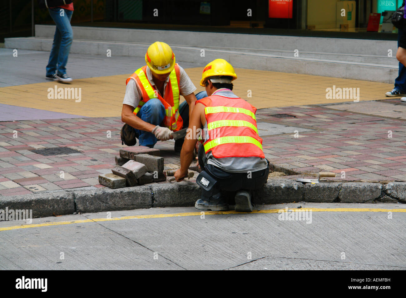 Construction workers working on pedestrian road Hong Kong China Stock ...
