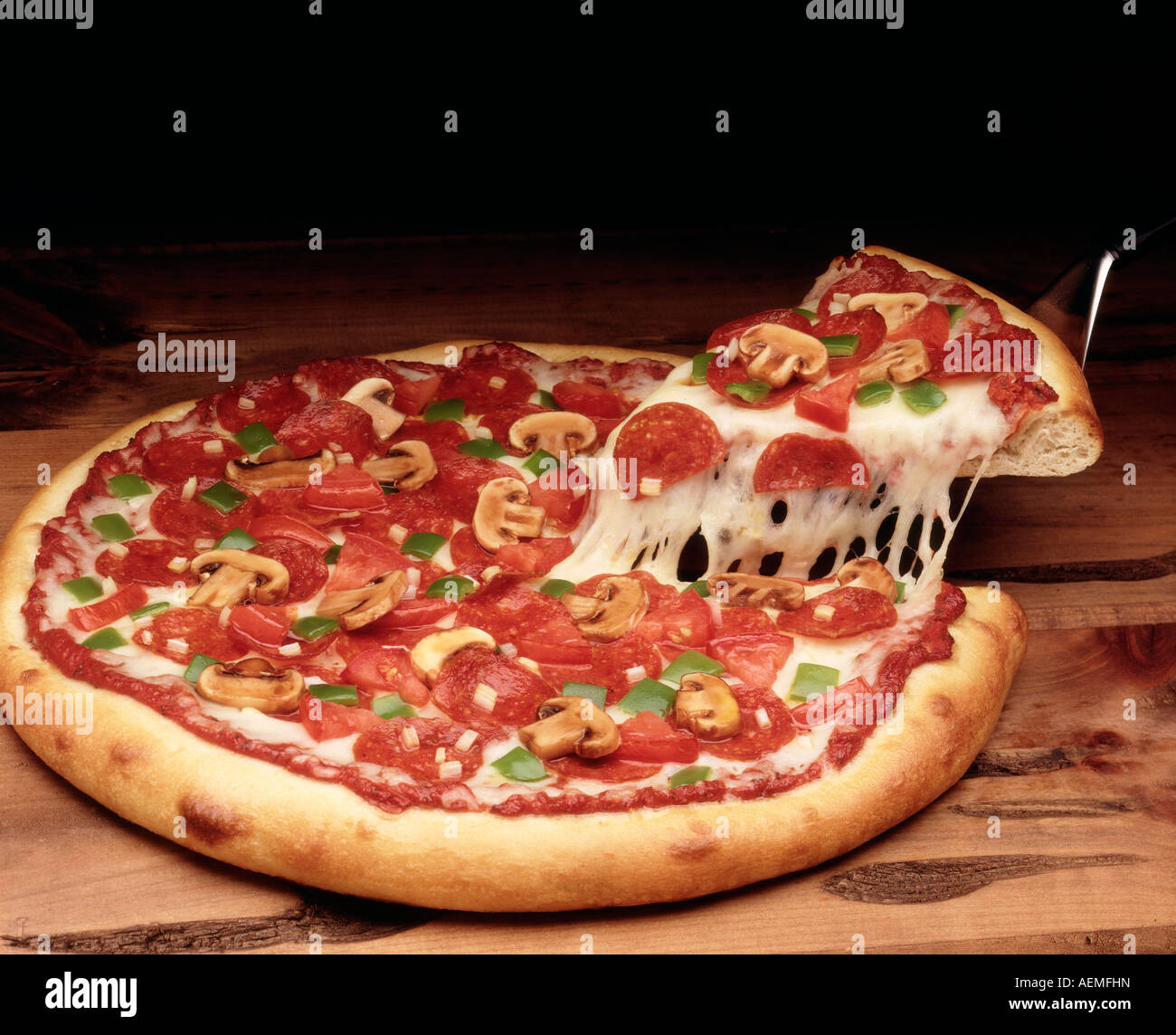 Whole Pizza Removing Slice Stock Photo - Alamy