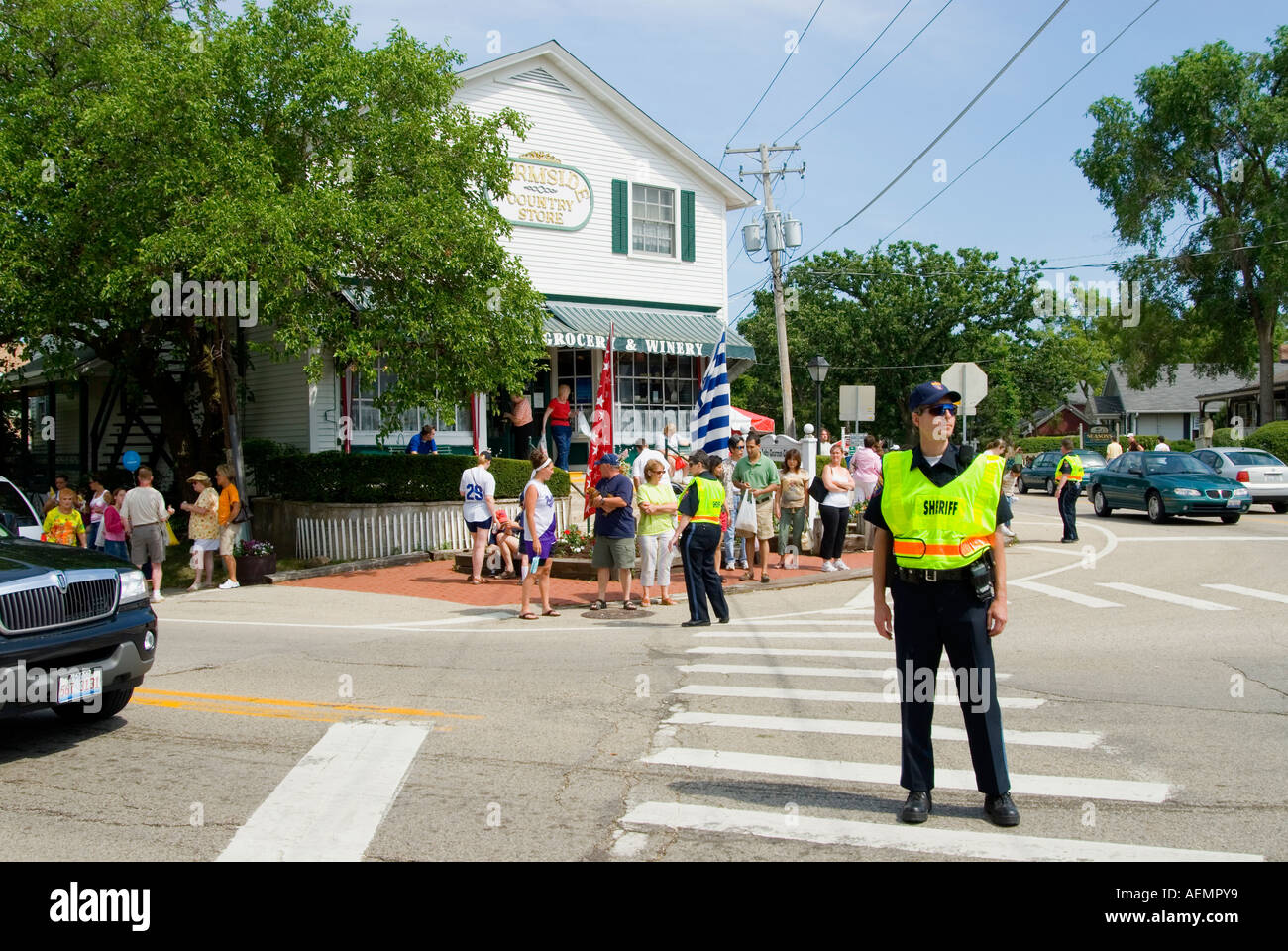 Main Street USA 2. Policeman directing traffic at rural crosswalk ...