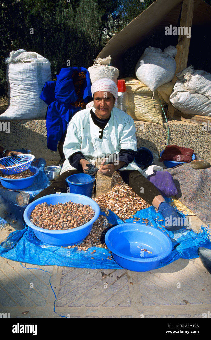 female worker sitting on the floor at the argan oil amal cooperative in ...