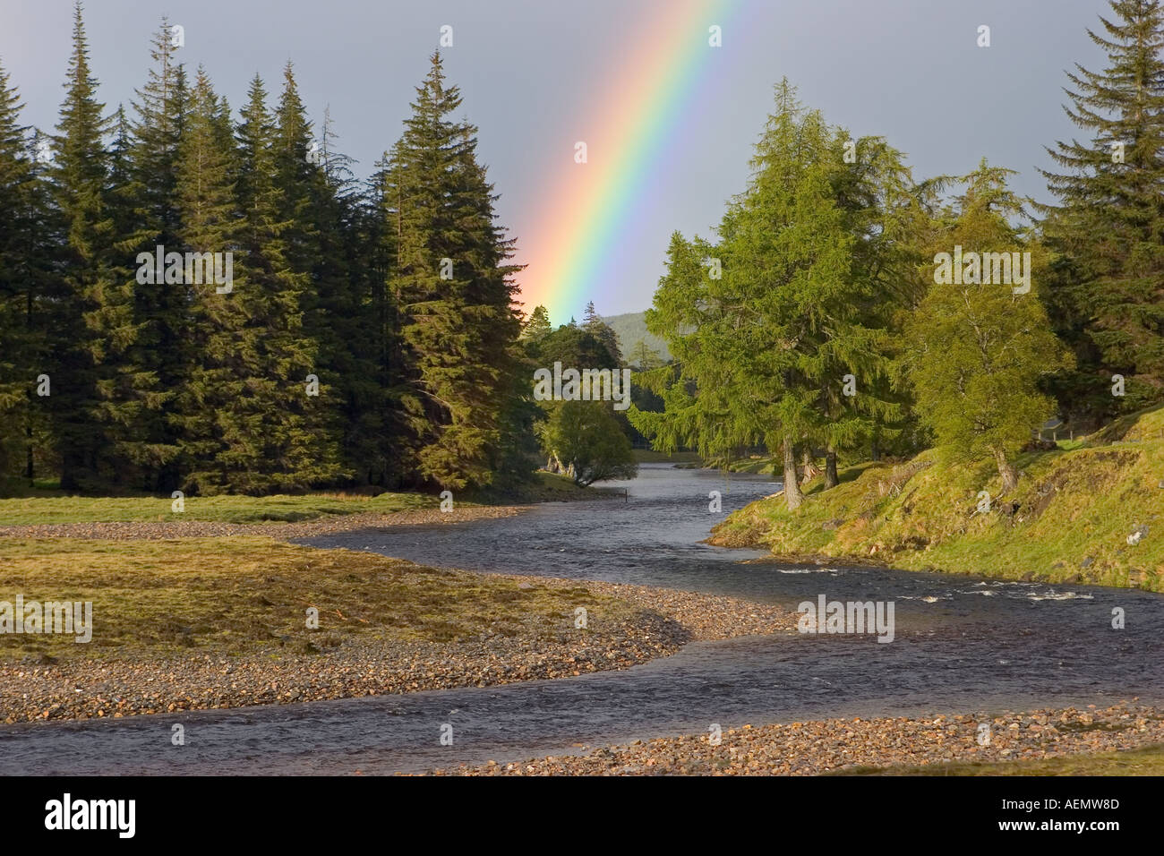 Scottish Highland scene; landscape with rainbow on the River Dee ...