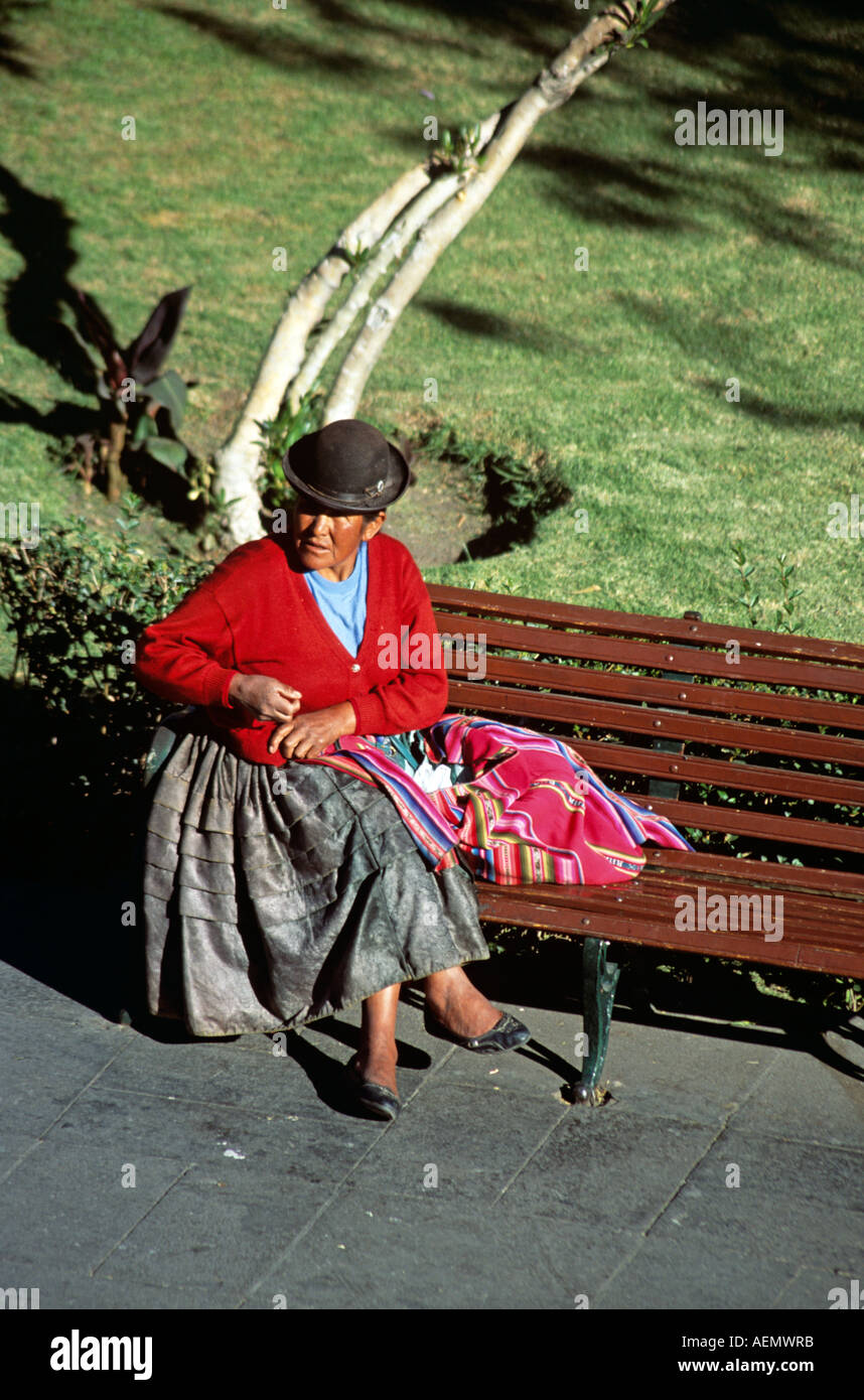Peruvian lady (Arequipena) sitting on bench, Plaza de Armas, Arequipa ...