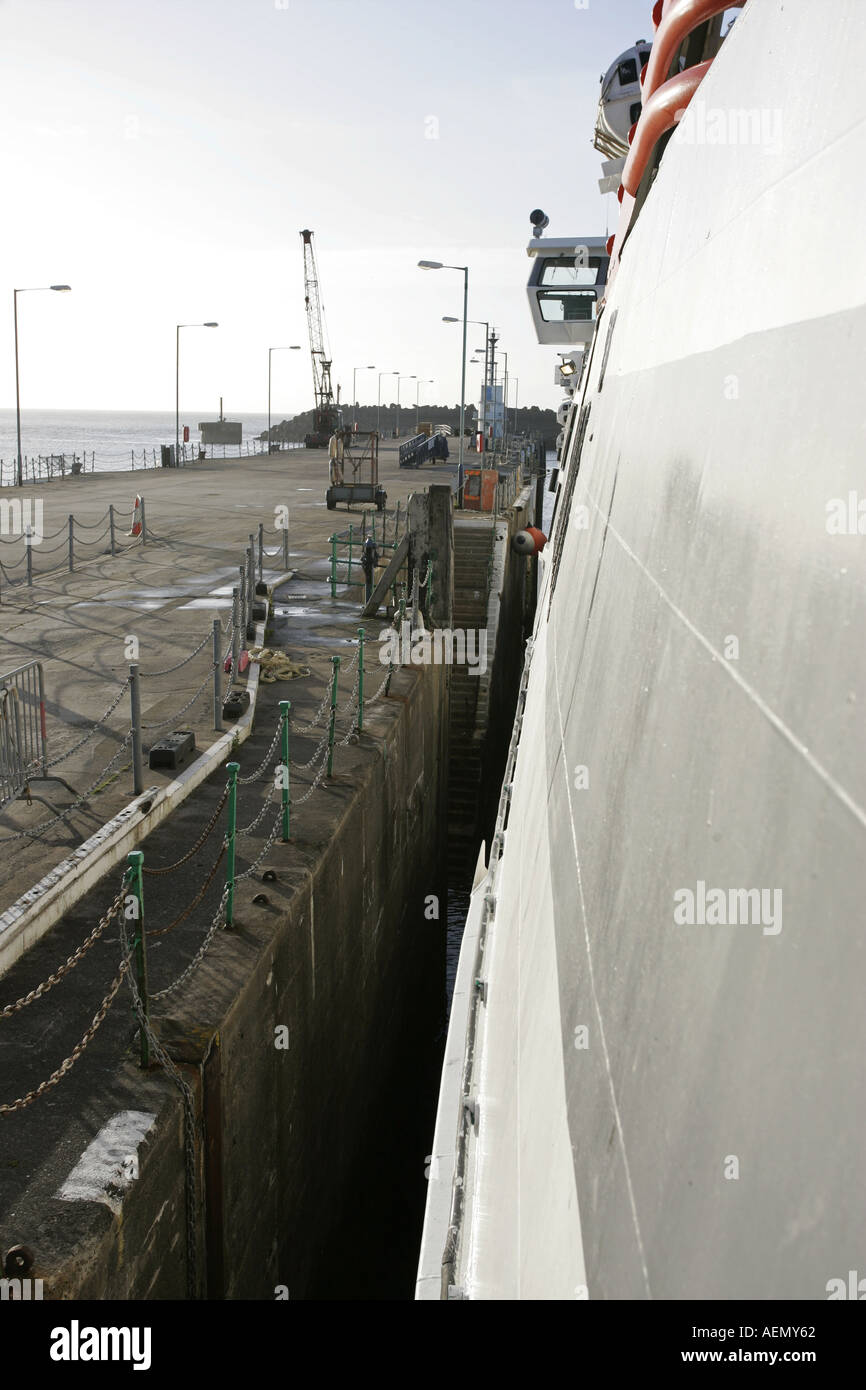 Side of super sea cat fast ferry tied up against the harbour douglas ...