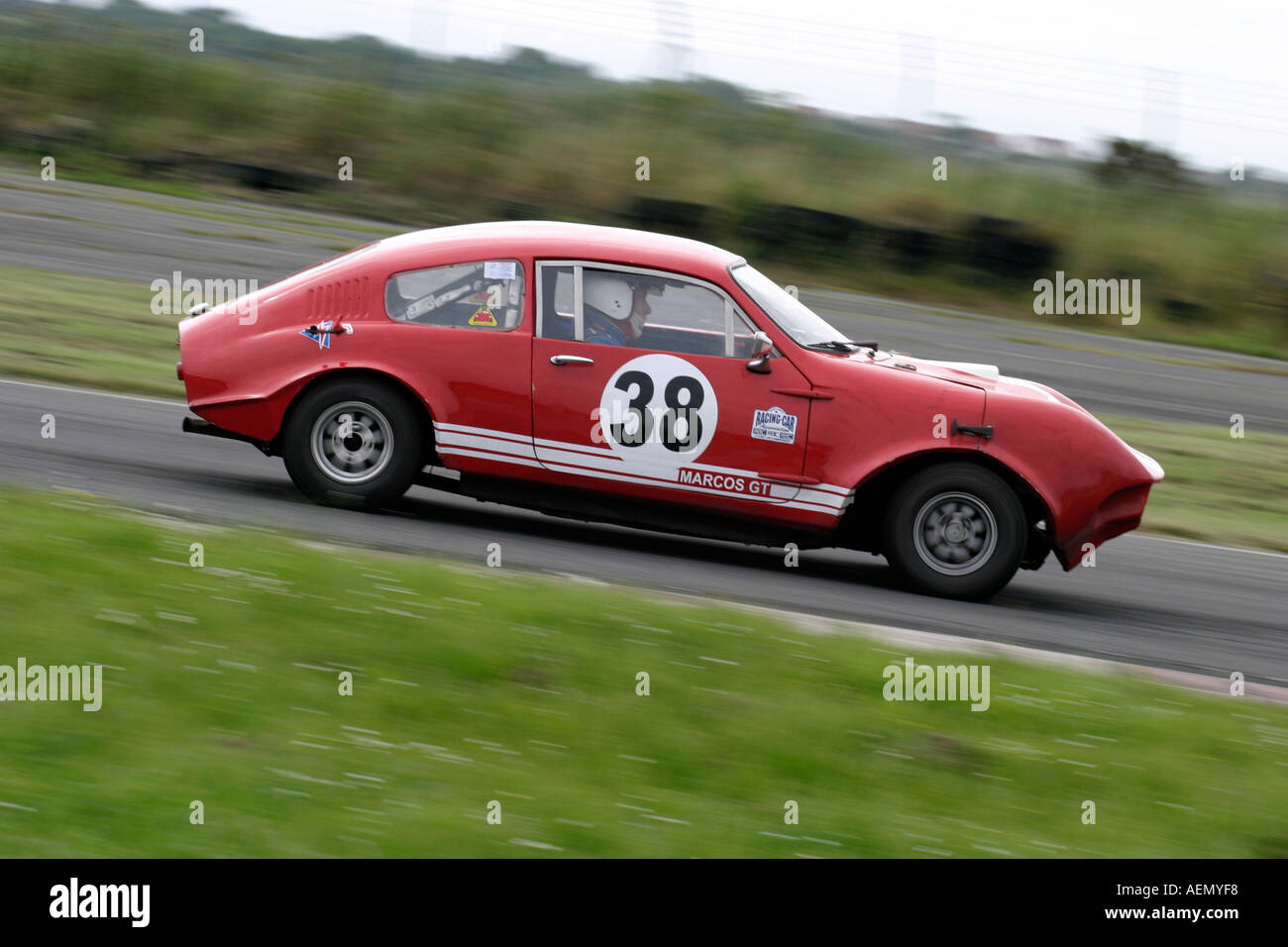 Des Quinn from Dublin in his red 1 3 Mini Marcos at Kirkistown Circuit ...