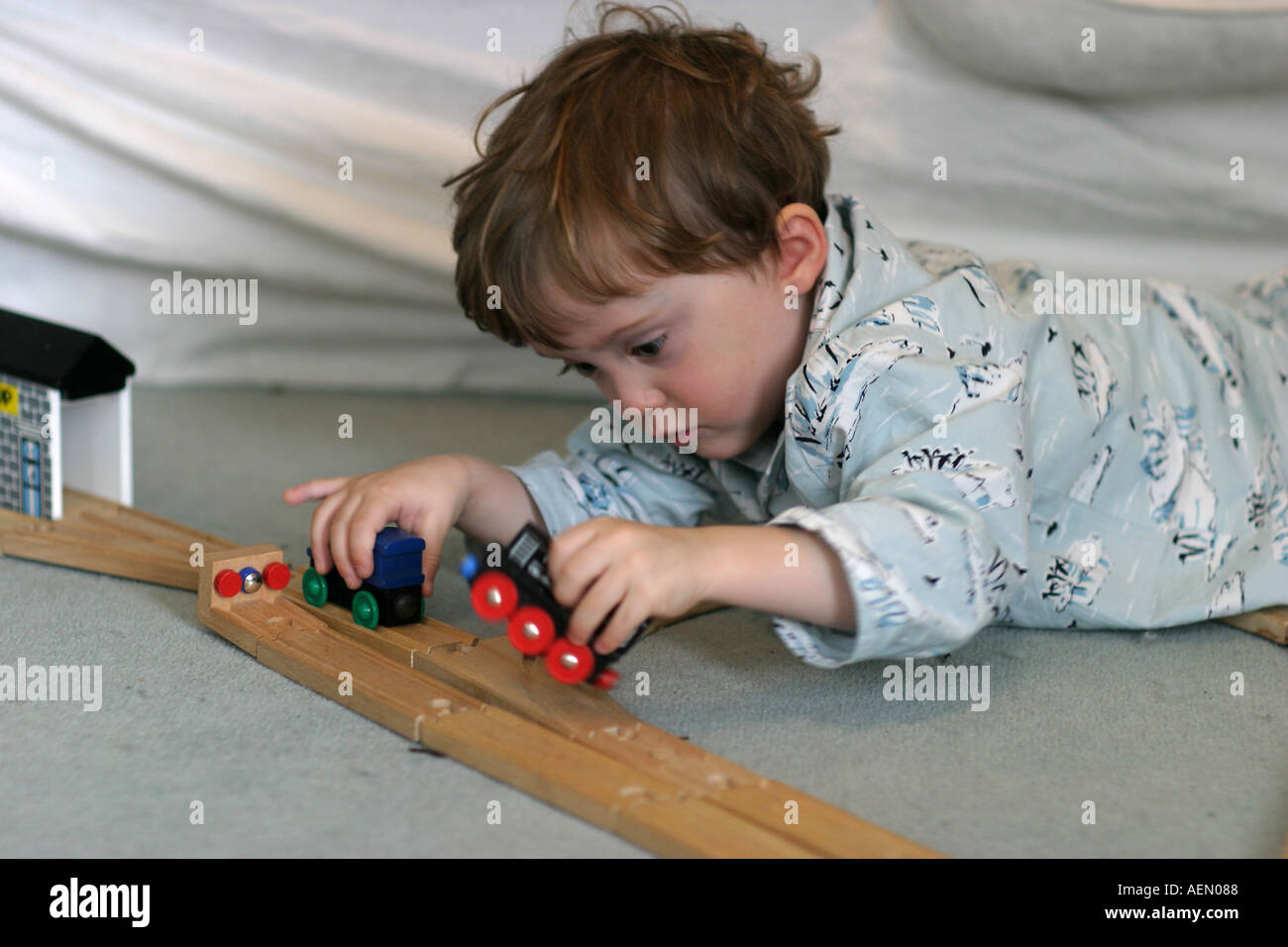 Lewis and his wooden train set Stock Photo - Alamy