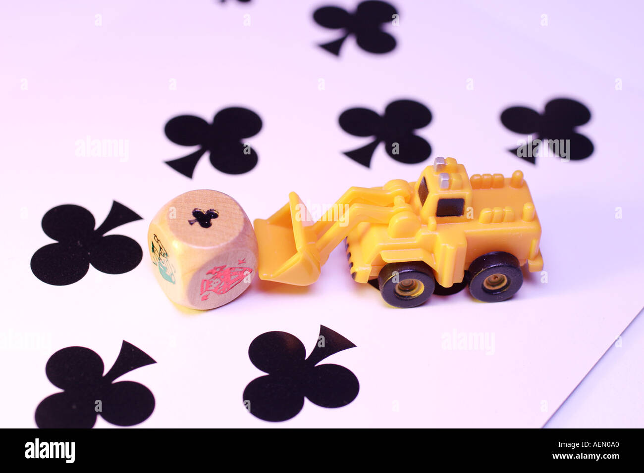 Toy Earthmover and Dice on Playing Card Stock Photo - Alamy