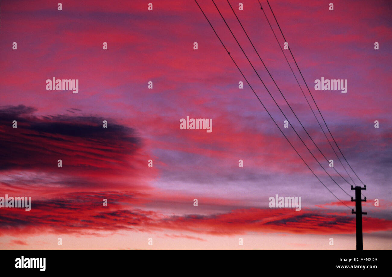 Lone Telegraph Pole And Lines Receding Into Distance With Blood Red Sky ...