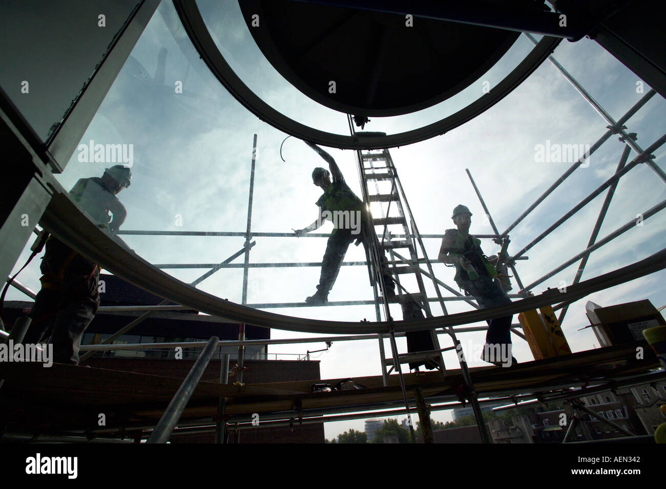 silhouetted glazing worker Stock Photo - Alamy