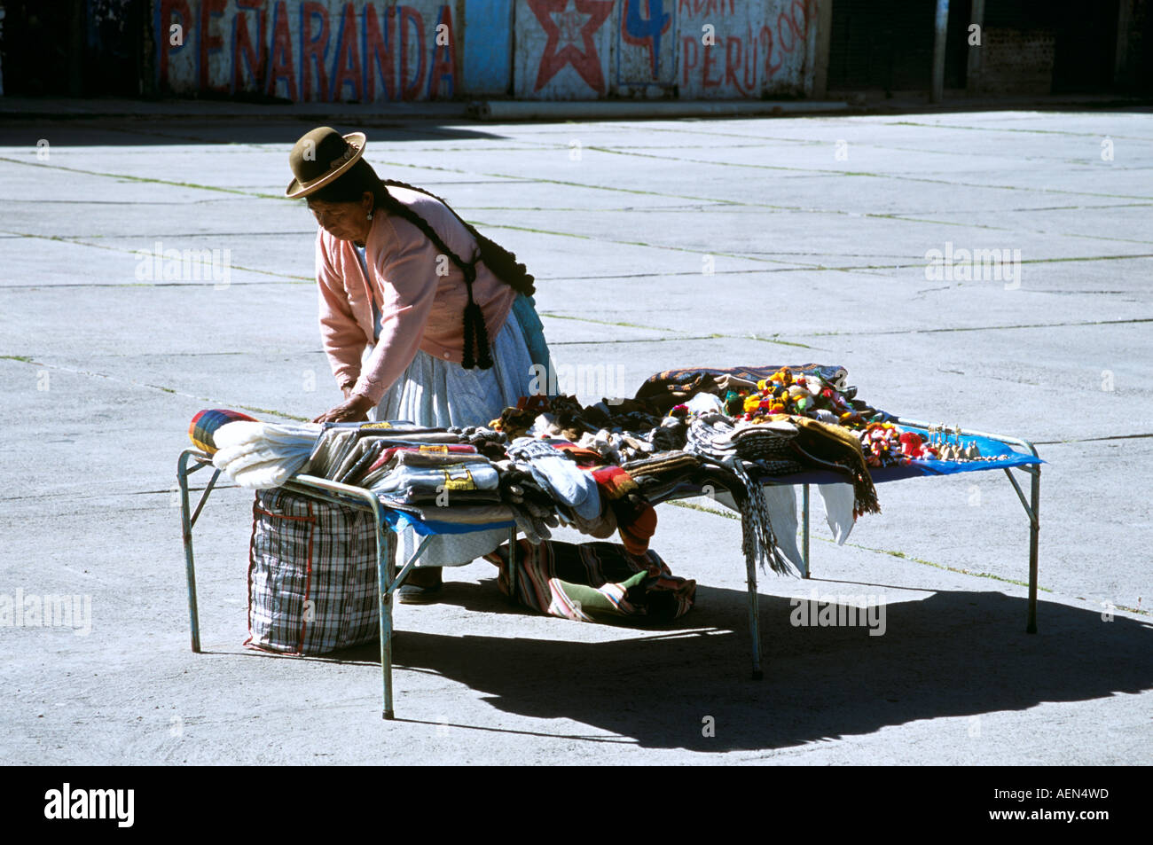 Lady setting up a stall, Pomata, Peru Stock Photo - Alamy