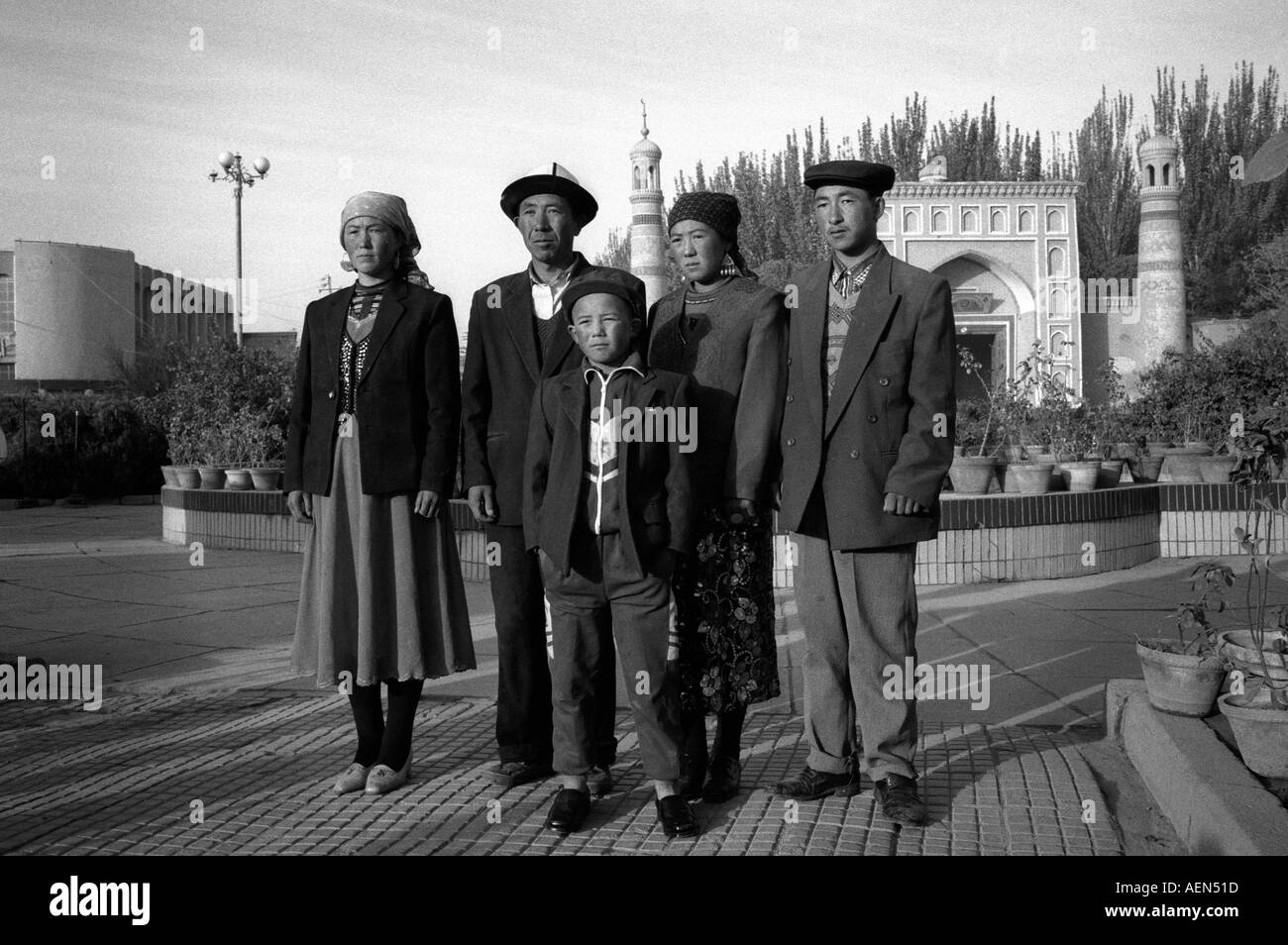 Uighur family posing for picture outside the Id Kah Mosque Kashgar ...