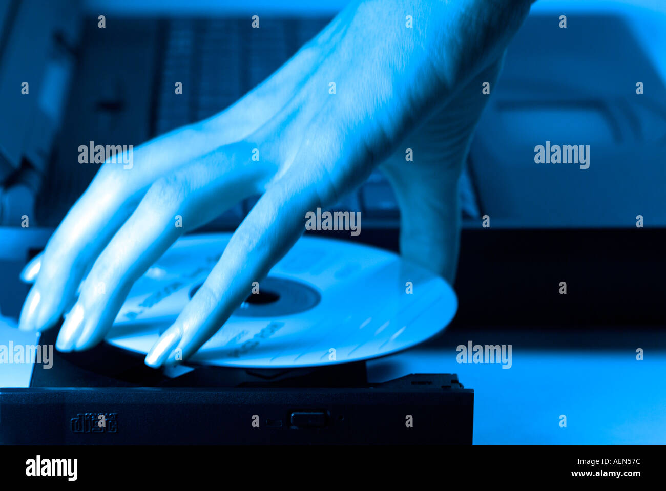 Hand removing cd hi-res stock photography and images - Alamy