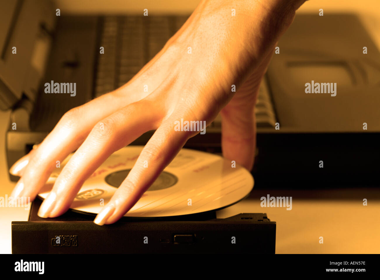 Hand removing cd hi-res stock photography and images - Alamy