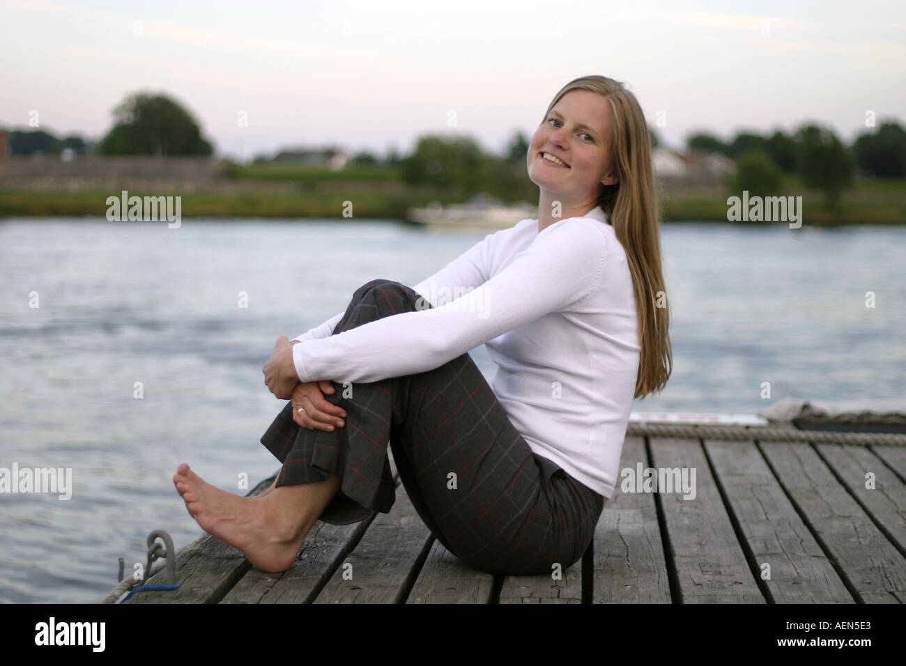Woman on Dock Stock Photo - Alamy