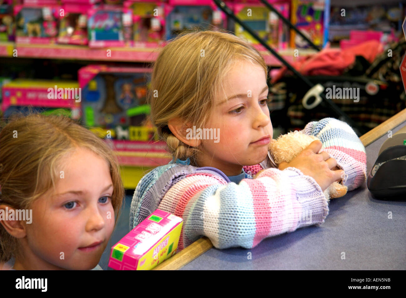 Young Girls at Toy Shop Counter People Lifestyle Wales Stock Photo - Alamy