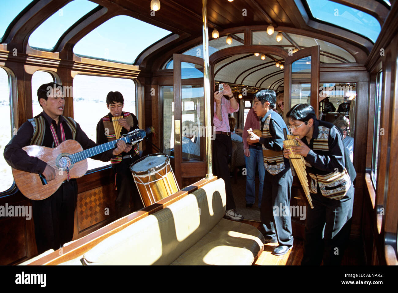 Traditional Peruvian band in carriage of Puno to Cusco Perurail train ...