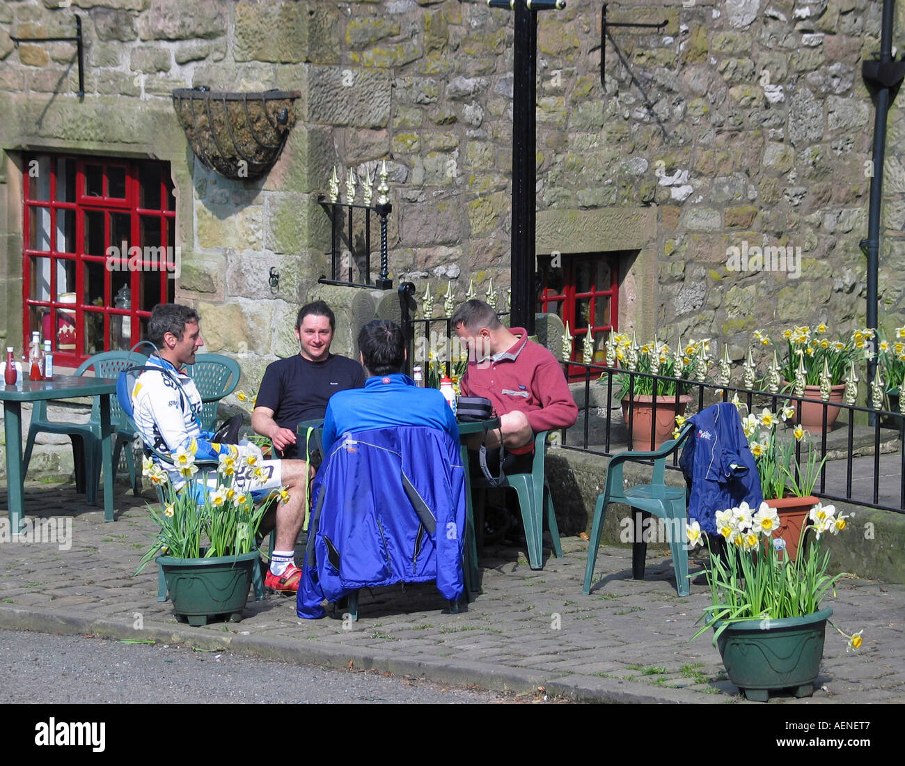 Group of friends having a tea break during bike riding the High Peak ...
