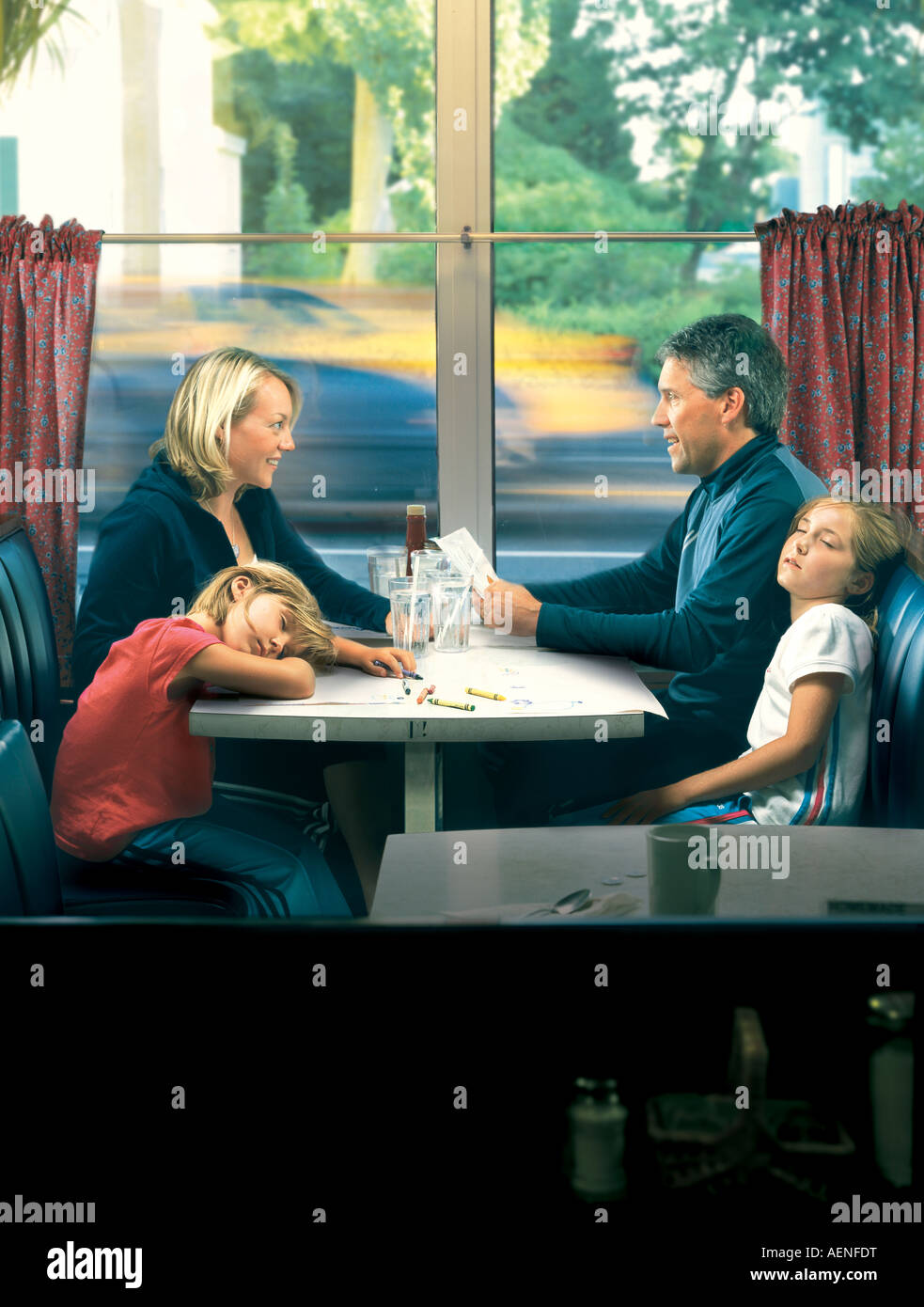 Two children fast asleep while out on a family dinner Stock Photo - Alamy