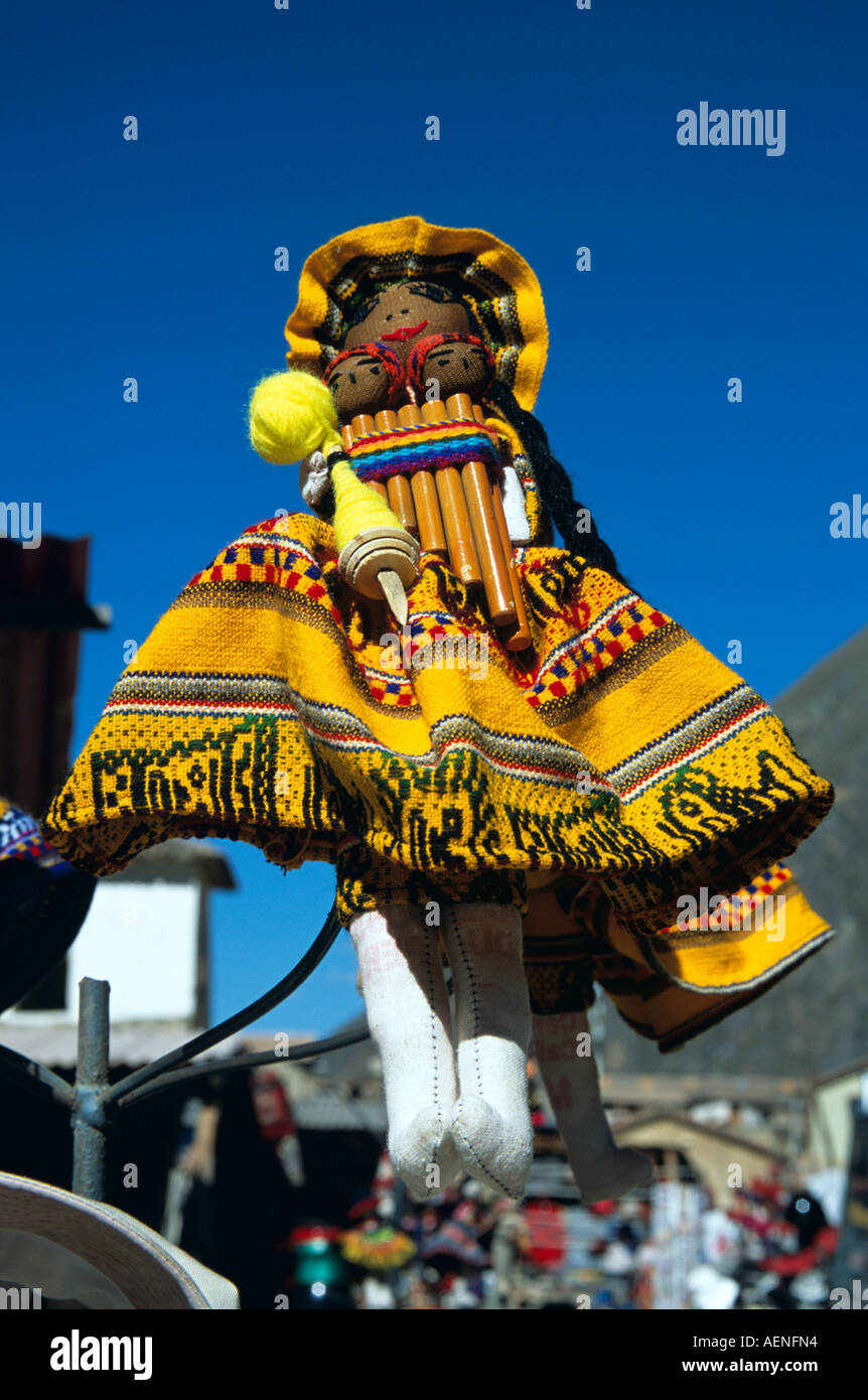 Colourful yellow doll on a stall in the market, Ollantaytambo, Sacred ...