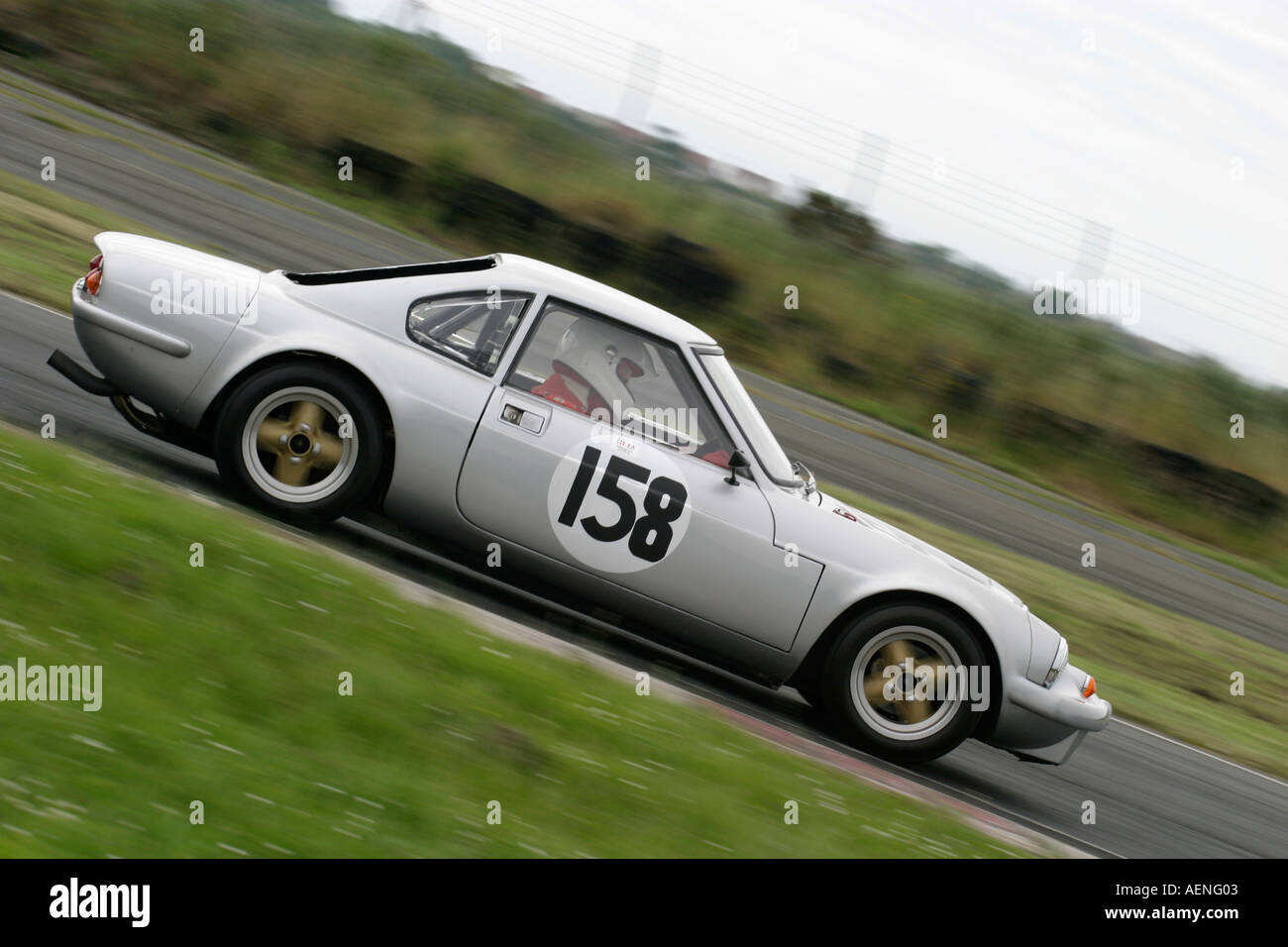 John McCandless from Holywood in his silver 1 5 Ginetta at Kirkistown ...