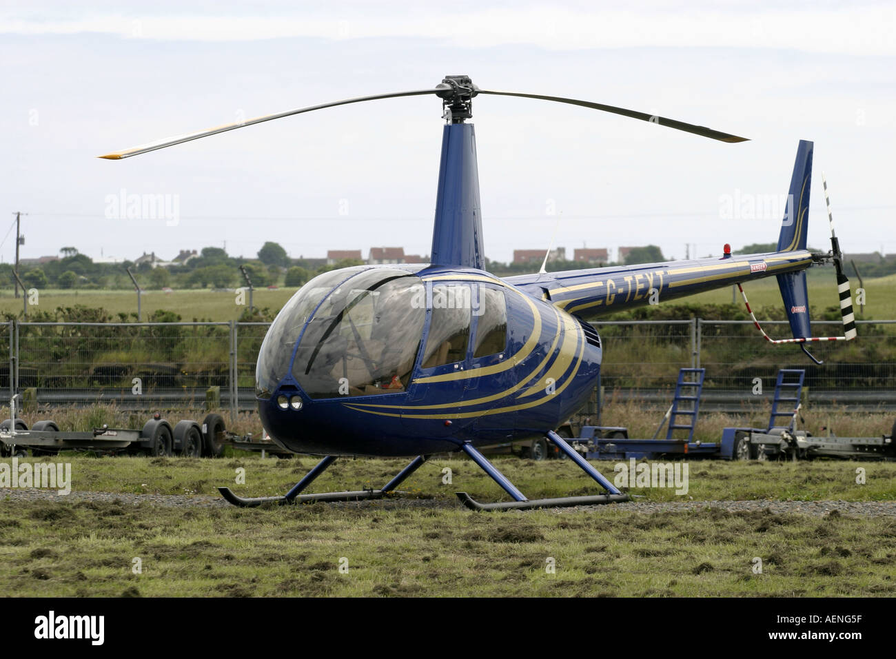 blue Robinson R44 Raven 2 II helicopter standing parked at Kirkistown ...