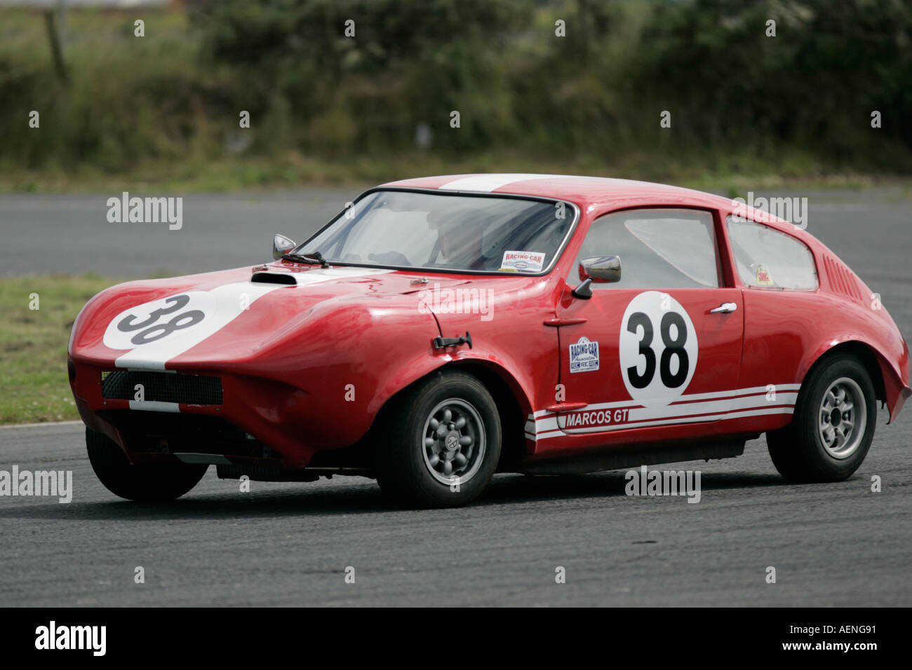 Des Quinn from Dublin in his red 1 3 Mini Marcos at Kirkistown Circuit ...