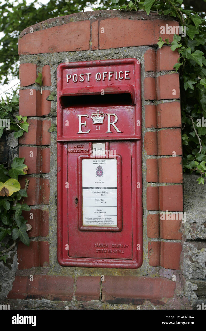 Red post office letter box in red brick wall Port Erin IOM Stock Photo ...
