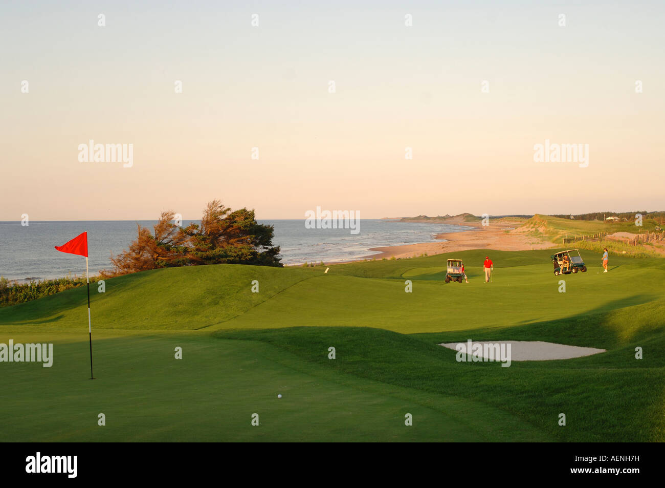 A fun game of golf with friends and a beautiful beach backdrop Stock ...