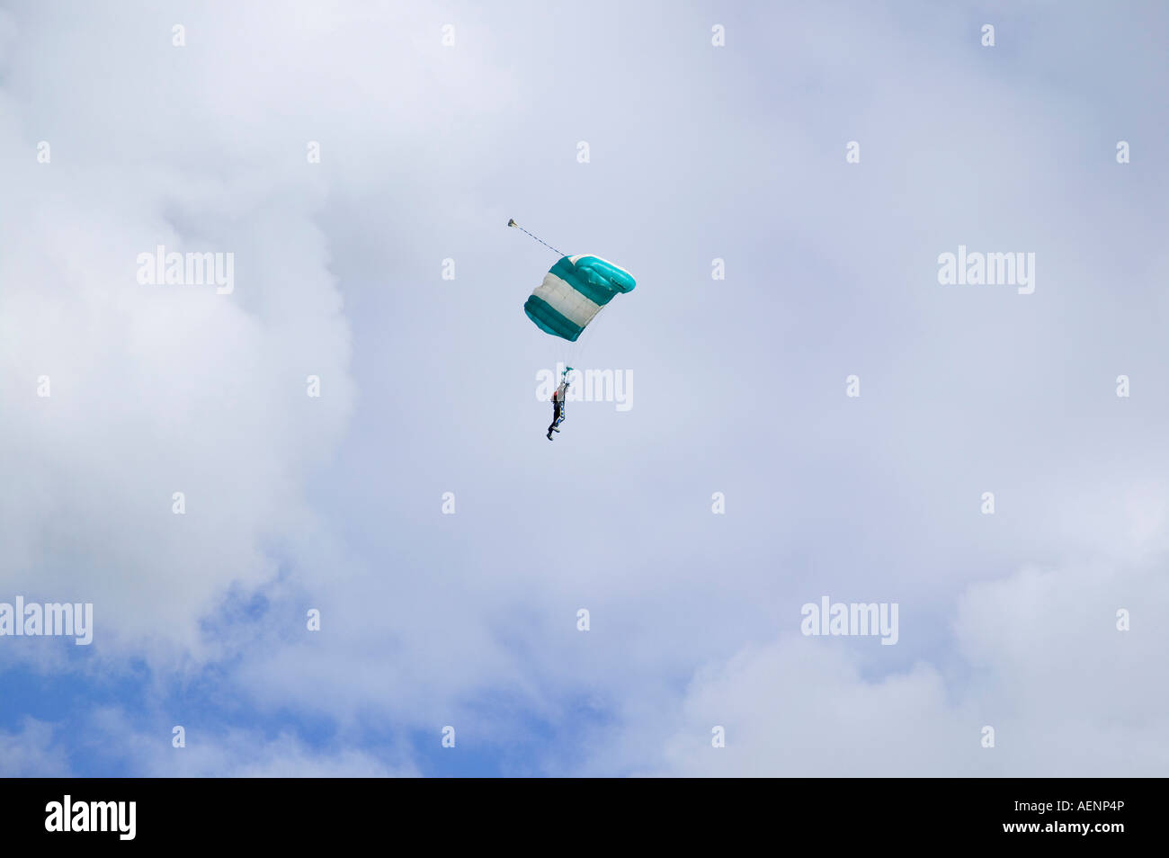 acrobatic parachutist blue jump suit green parachute Stock Photo - Alamy
