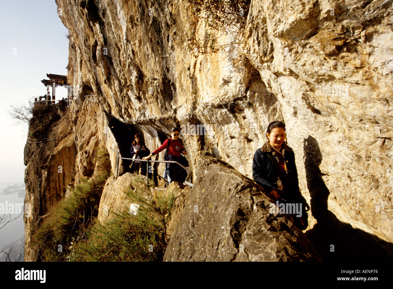 Kunming Yunnan China Tourists on narrow path at Dragon Gate on the ...