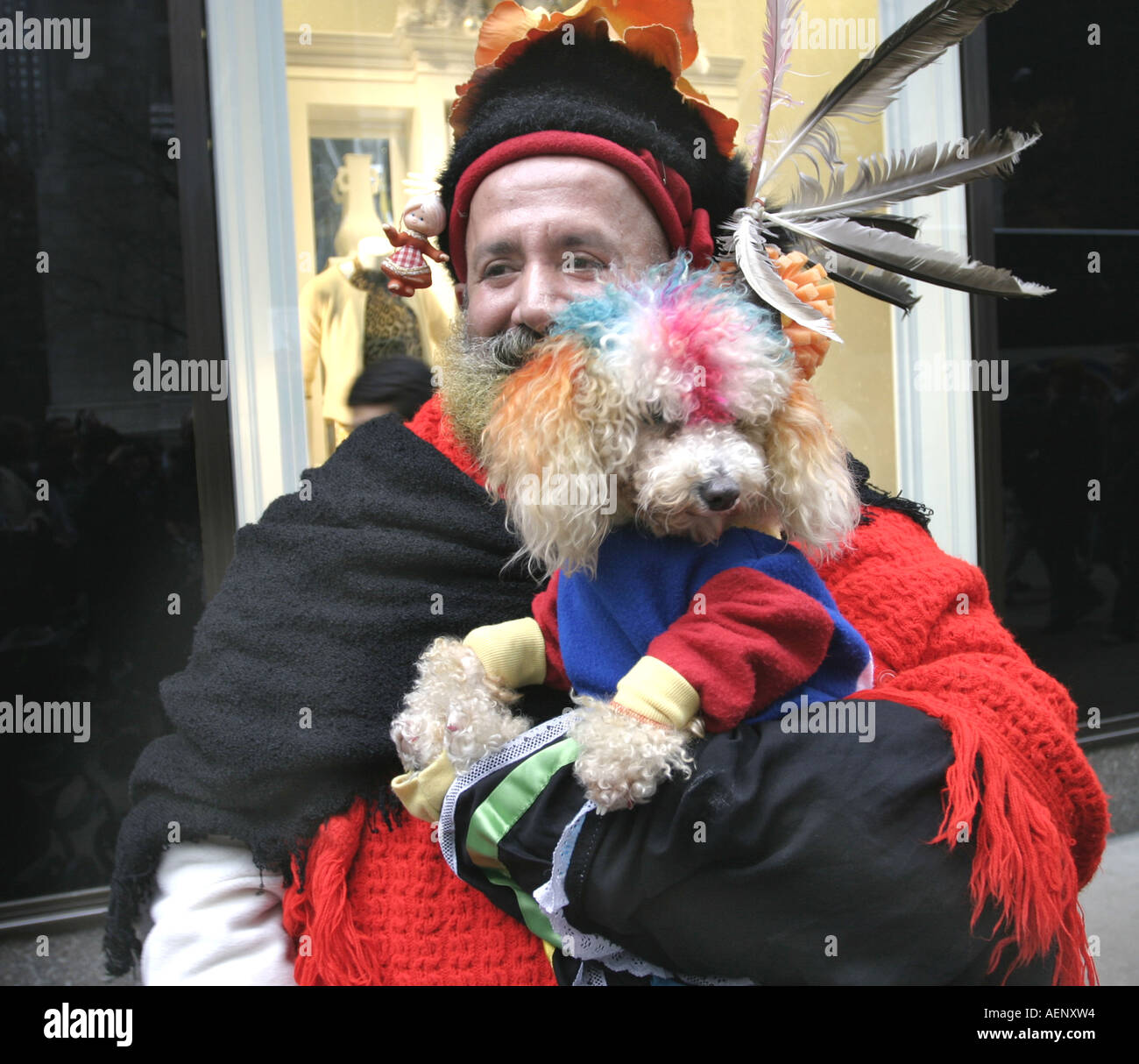 Colourful and eccentricly dressed man with coloured poodle on the ...