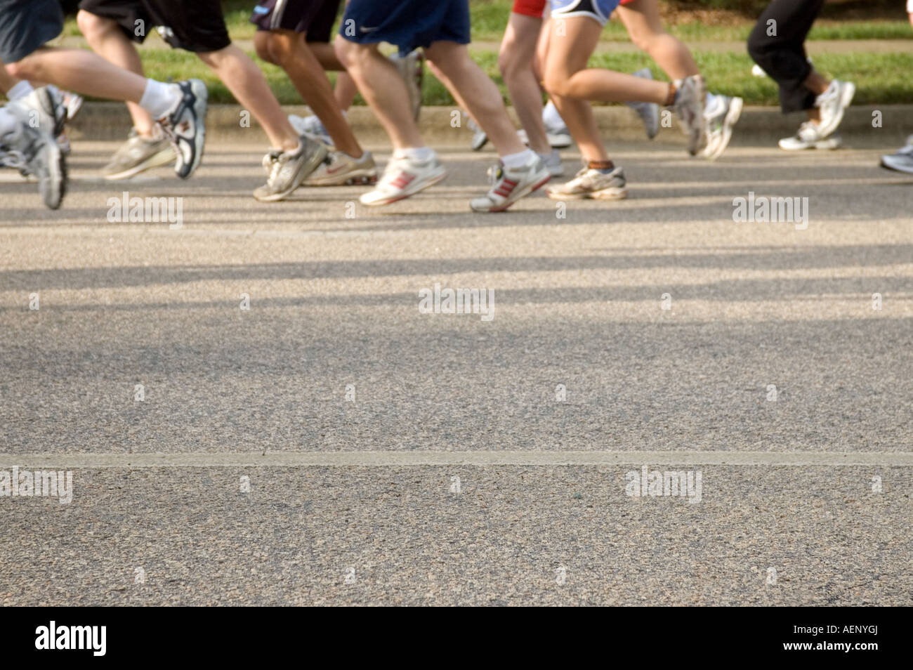 Feet and partial leg view of many people running in outdoors Stock ...