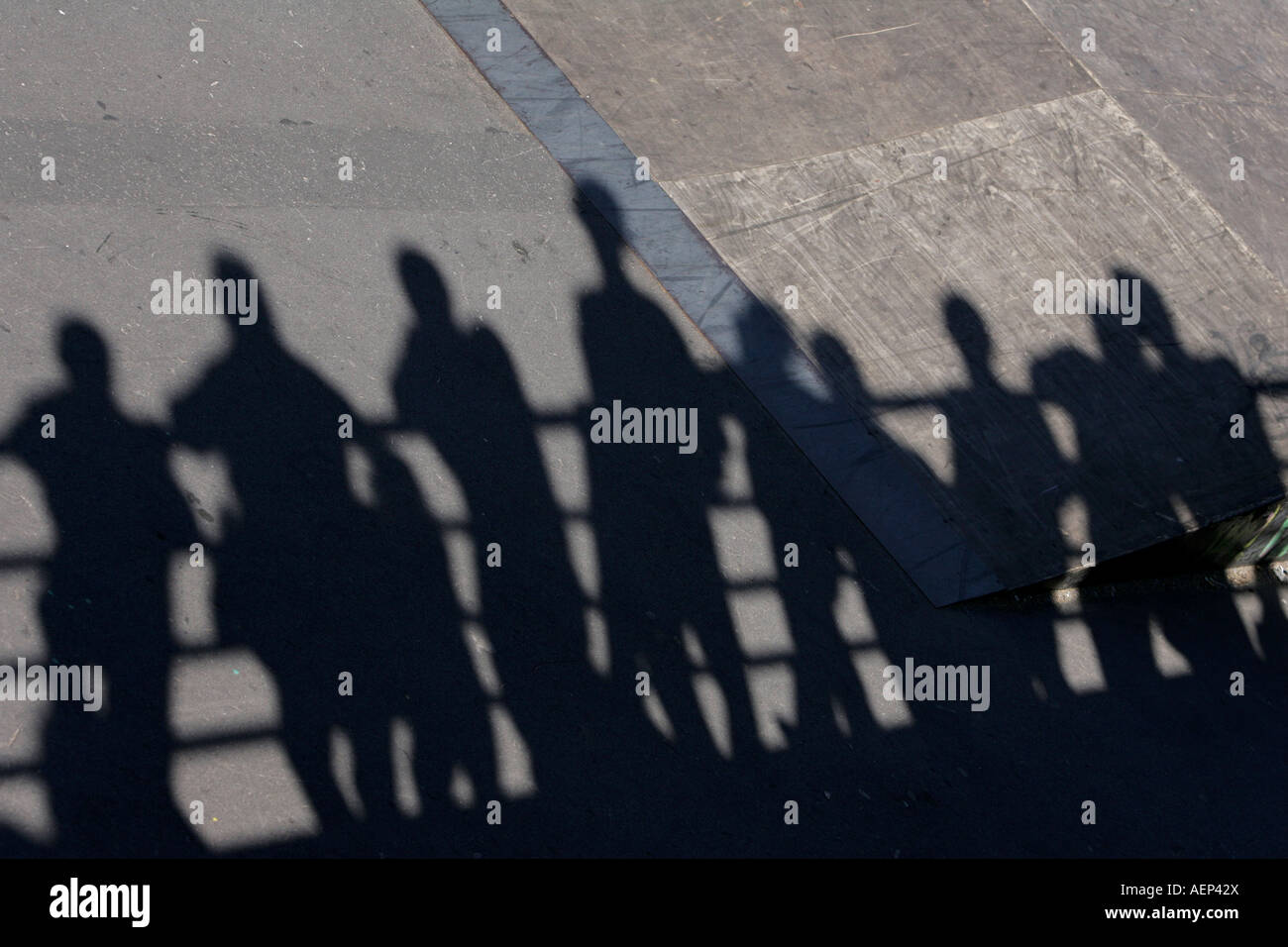 human shadows people on the fence Stock Photo - Alamy