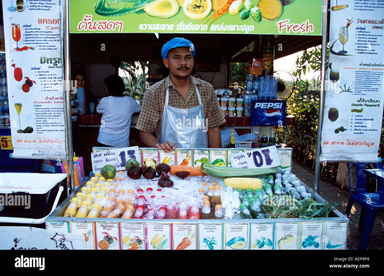 Man selling food and drinks on a food stall, Phitsanulok, Thailand ...