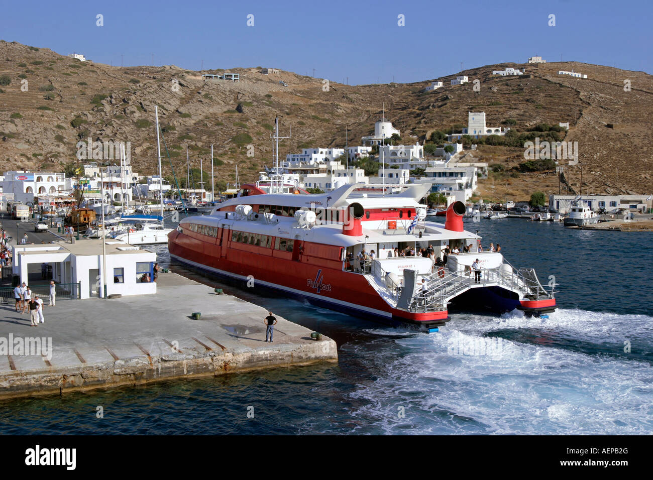 europe greece cyclades islands ios a red fast cat ferry arriving in ios ...