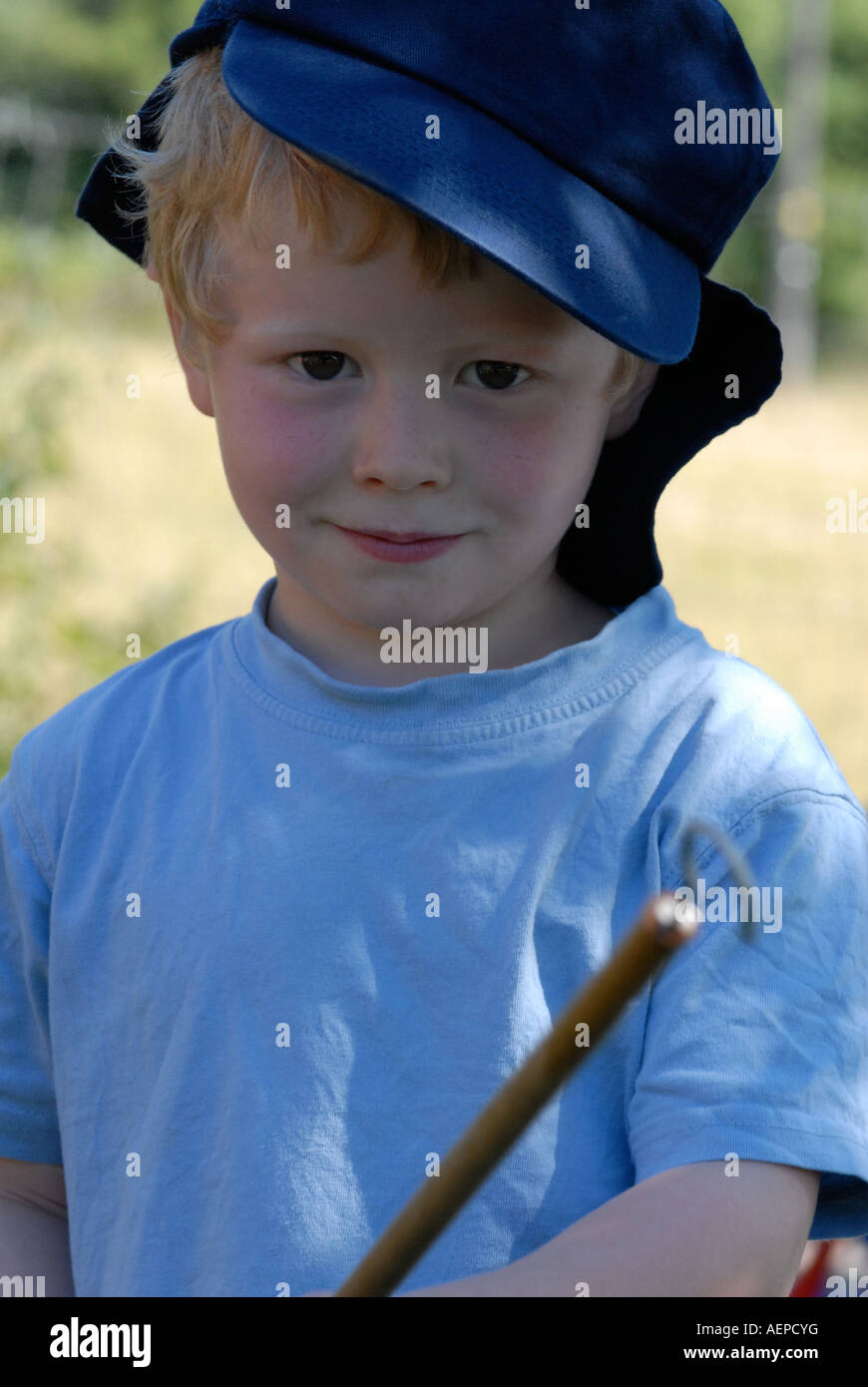Boy holding a stick hi-res stock photography and images - Alamy