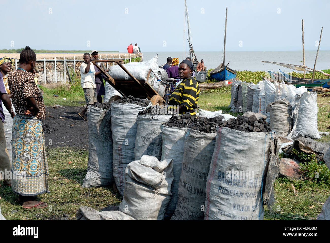 Luo women with sacks of charcoal imported from Uganda across Lake ...