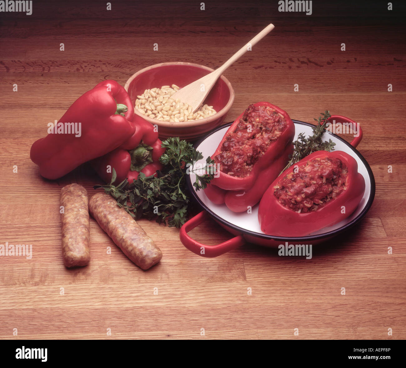 Red Peppers with Sausage Stuffing on Butcher Block Stock Photo - Alamy
