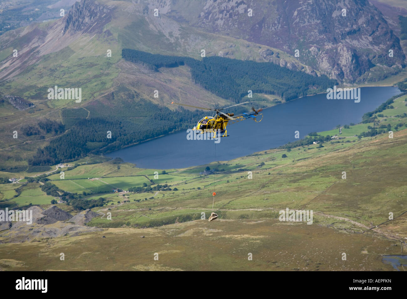 Helicopter flying material to build the new cafe on the top of Snowdon ...