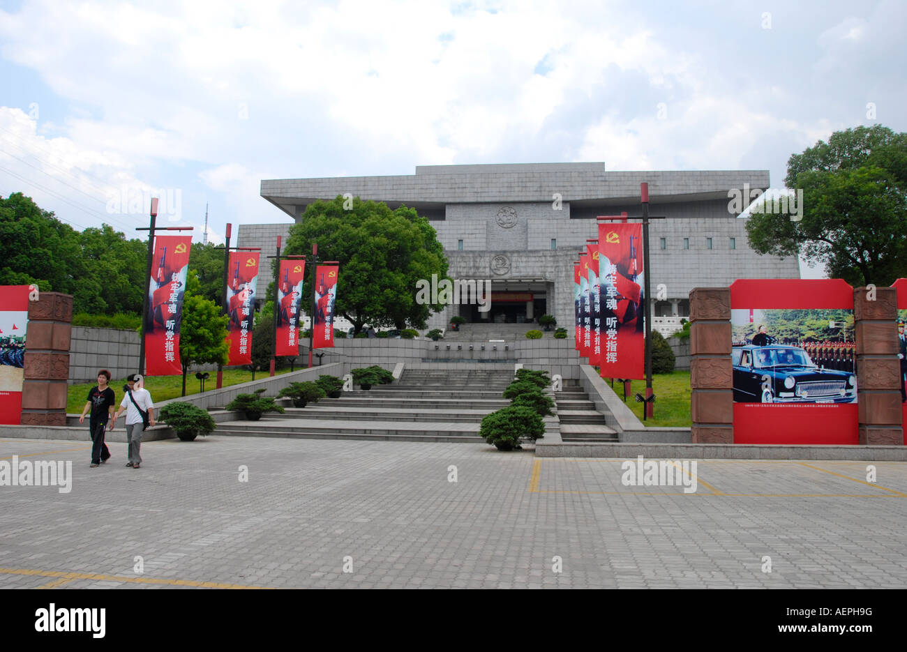 Outside view of Hunan Provincial Museum, with two visitors walking out ...